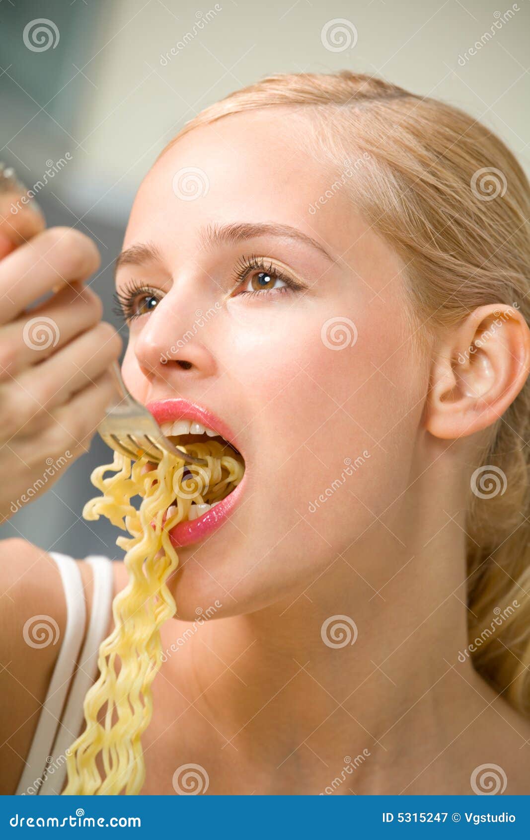 Woman eating spaghetti stock image. Image of face, people - 5315247