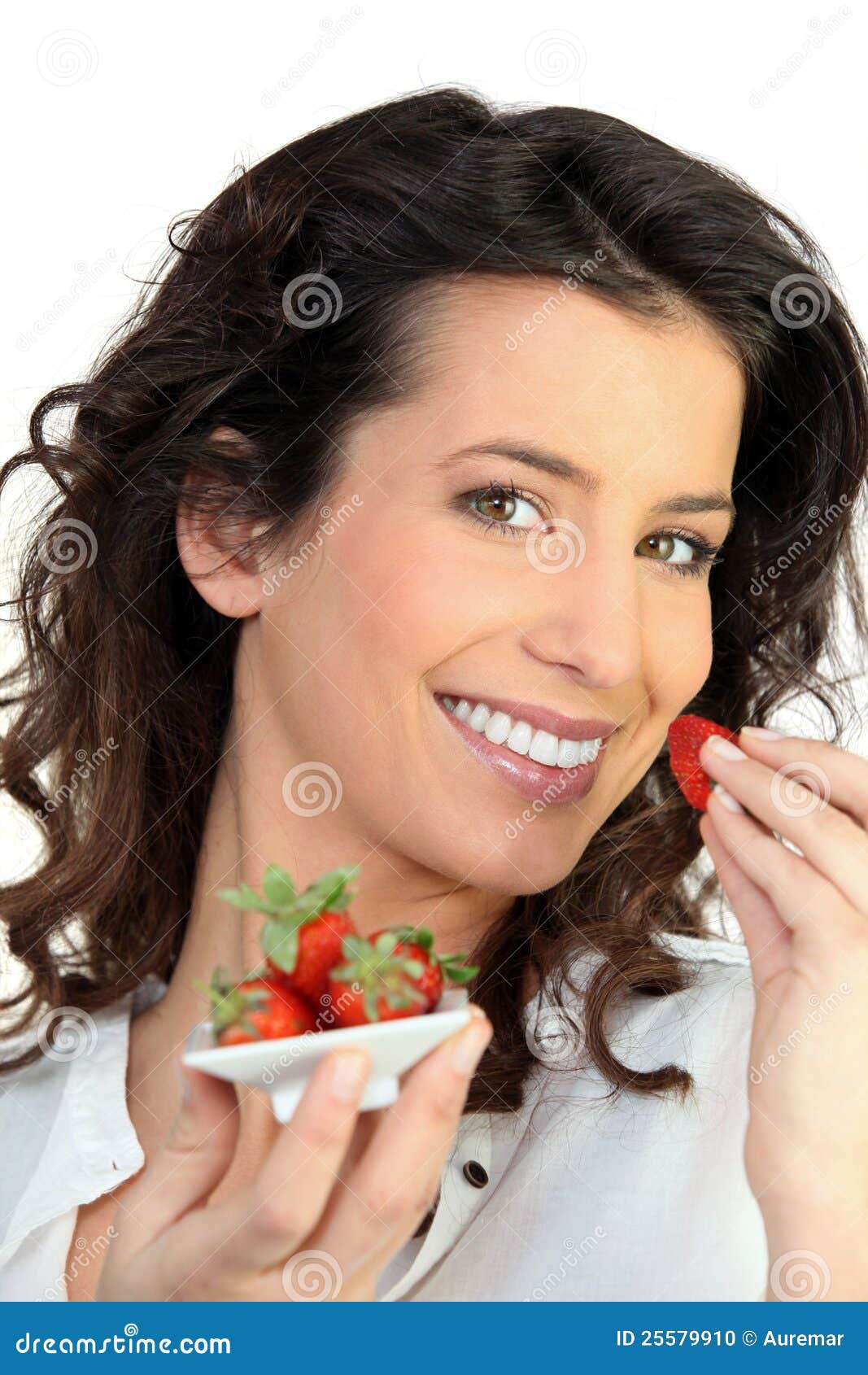 Woman eating strawberries stock photo. Image of food - 25579910