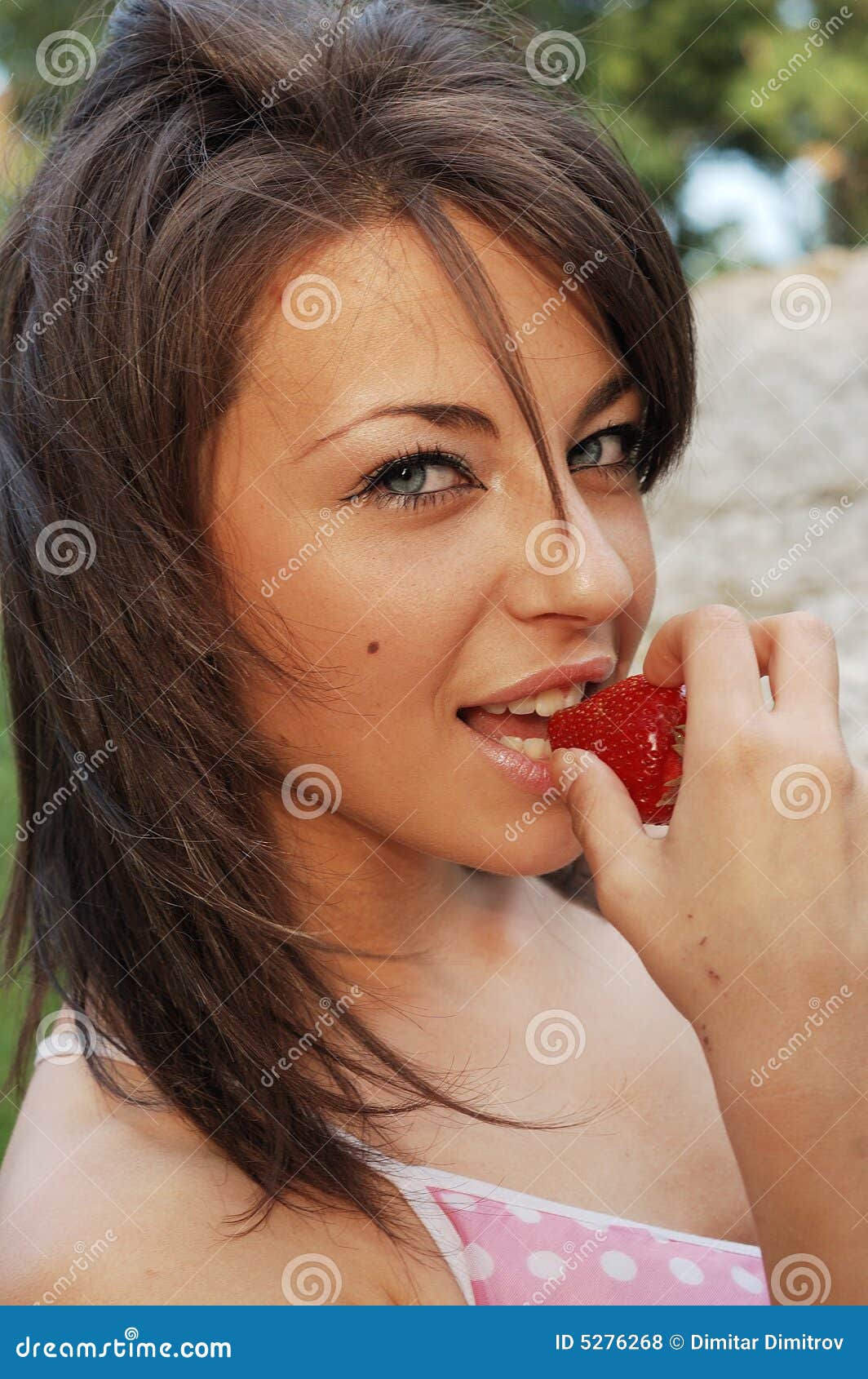 Woman Eating a Strawberry stock photo. Image of outdoor - 5276268