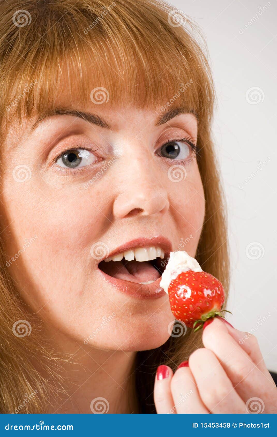 Woman Eating Strawberry and Cream Stock Photo - Image of cream ...