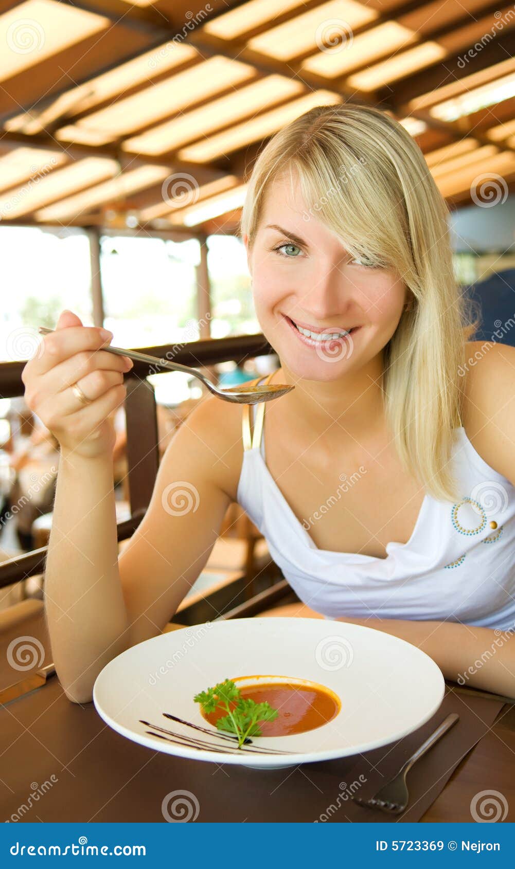 Woman eating tomato soup stock image. Image of blond, people - 5723369