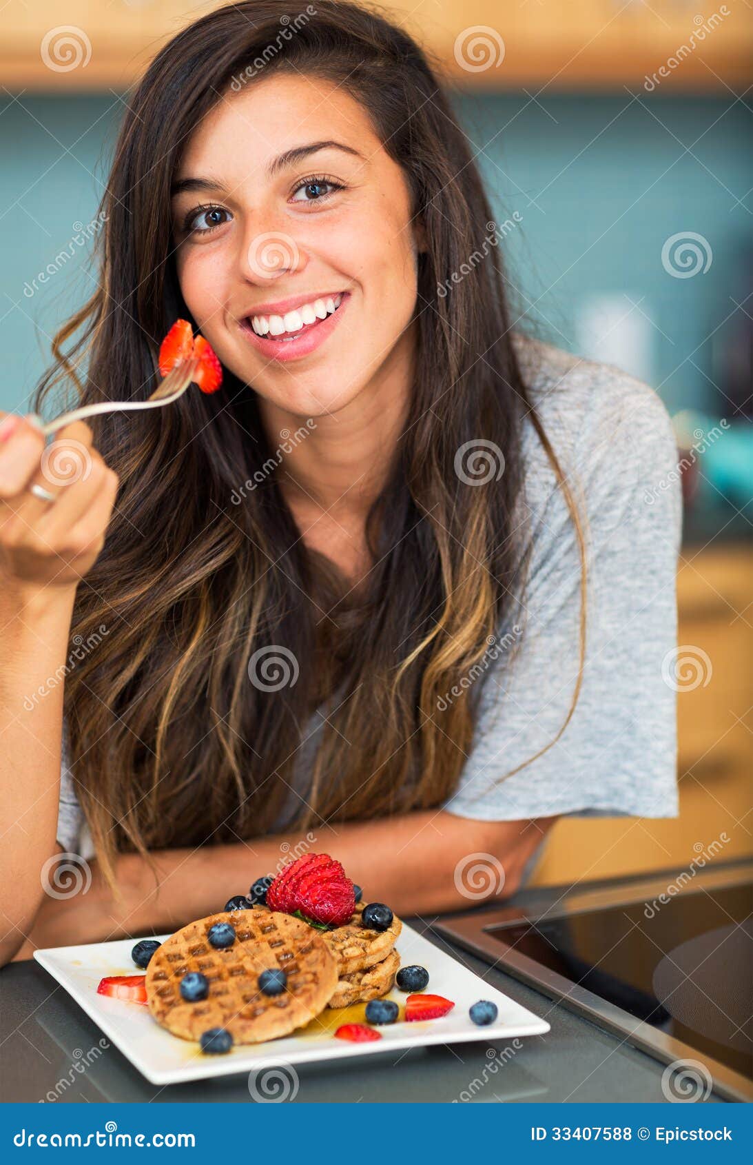Woman Eating Waffles with Fresh Fruit Stock Photo - Image of brunette ...