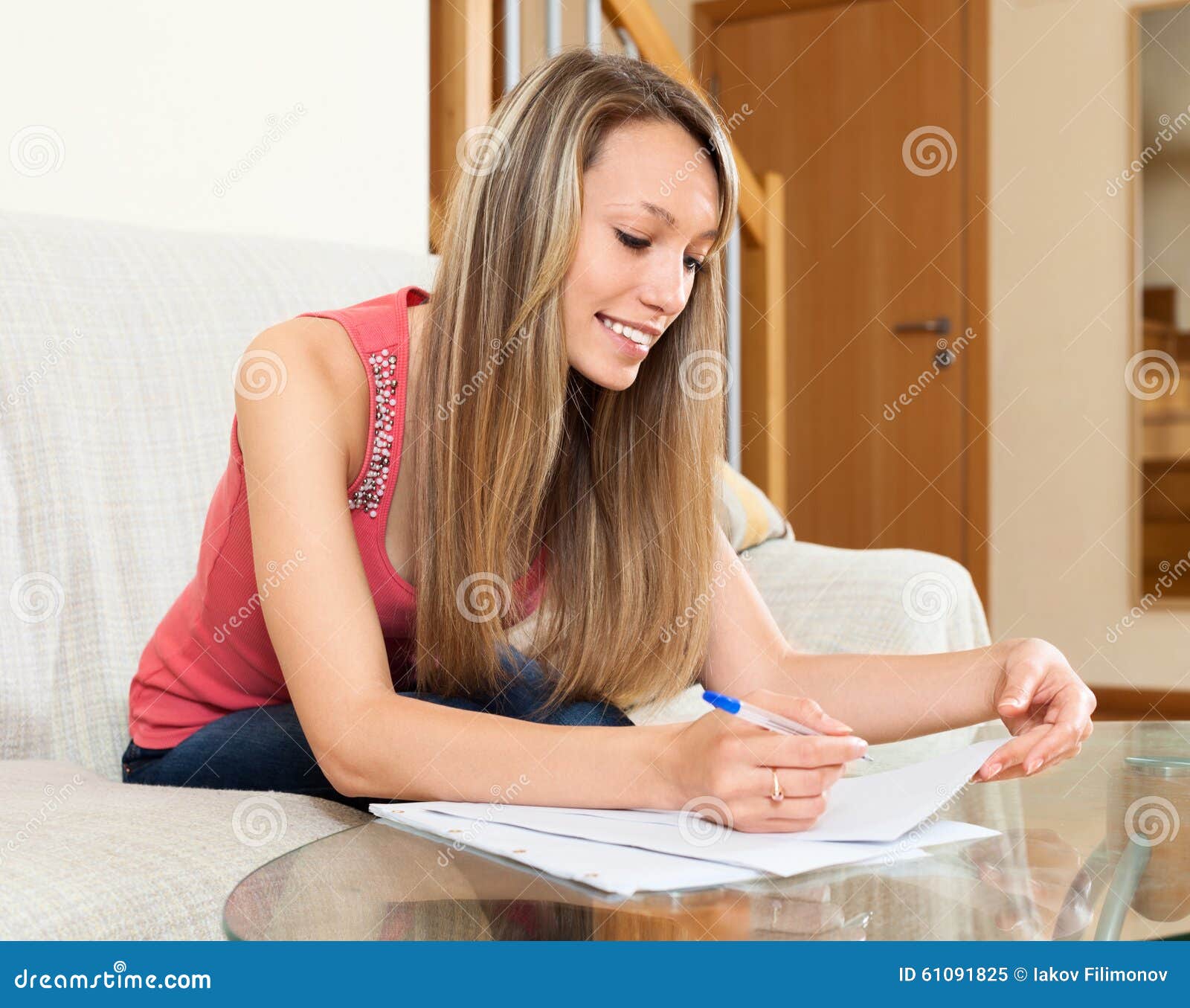 Woman Editing Documents on Sofa Stock Image - Image of jeans, materials ...