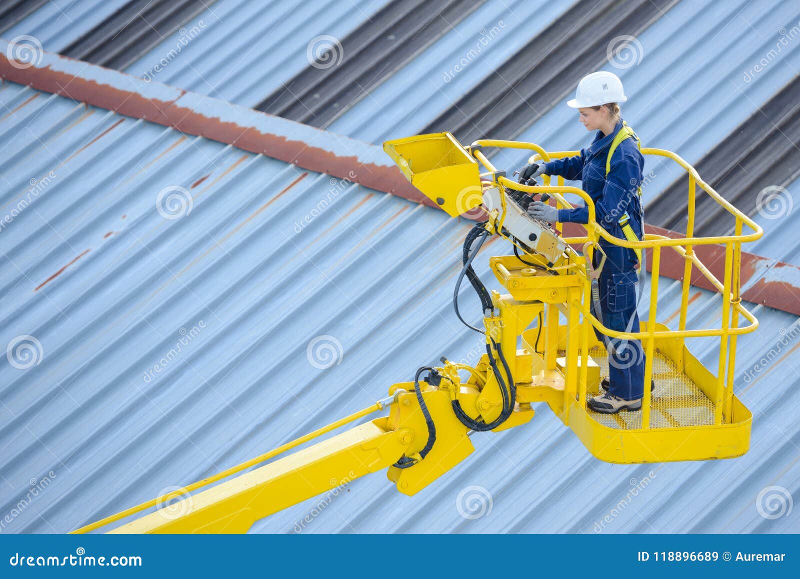 Woman in elevated basket stock image. Image of work - 118896689