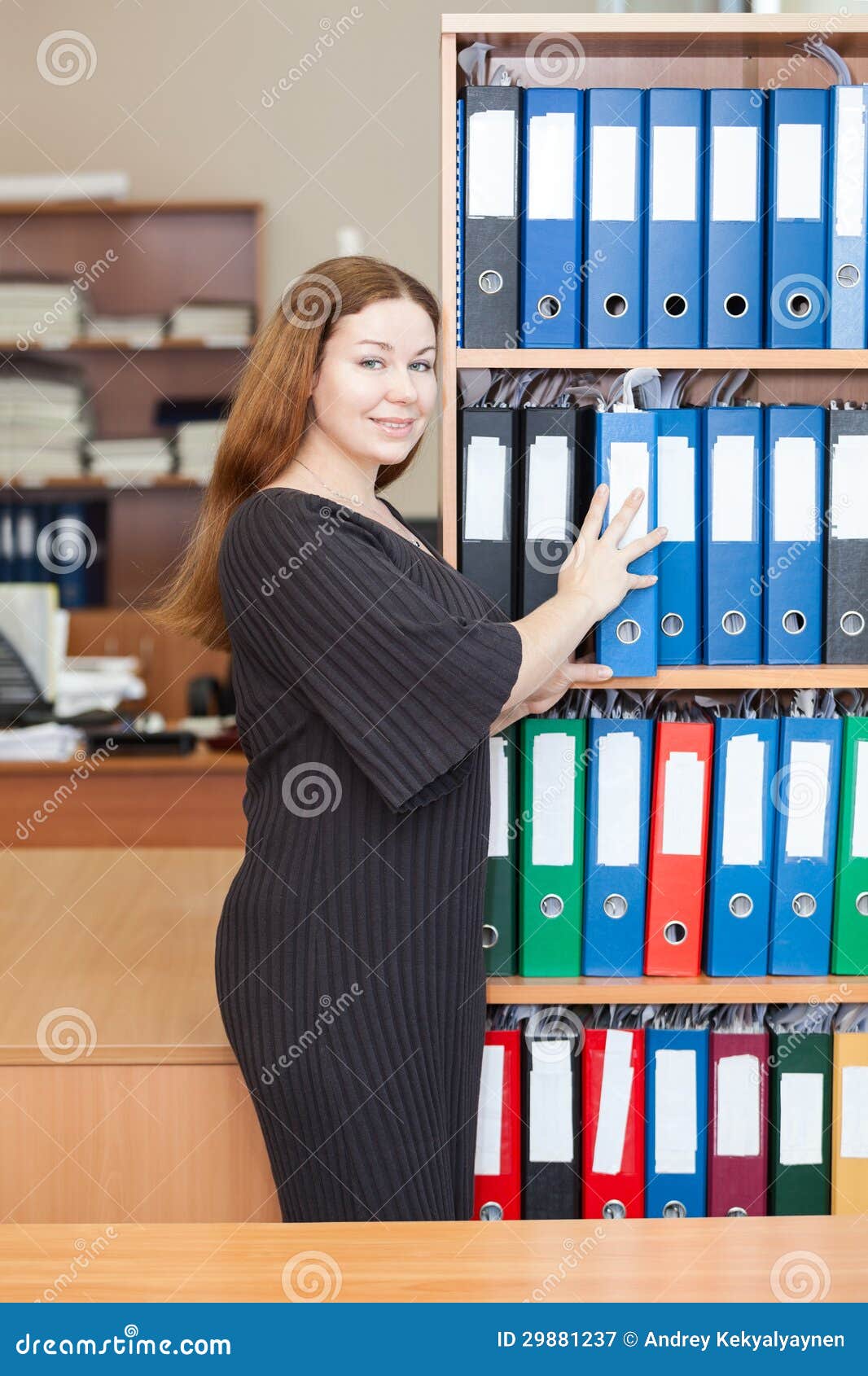 Woman Employee in Office Standing Near Archive Stock Image - Image of ...
