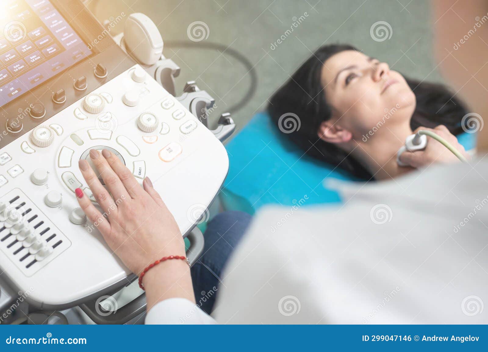 Woman Endocrinologist Making Ultrasonography To A Female Patient In An