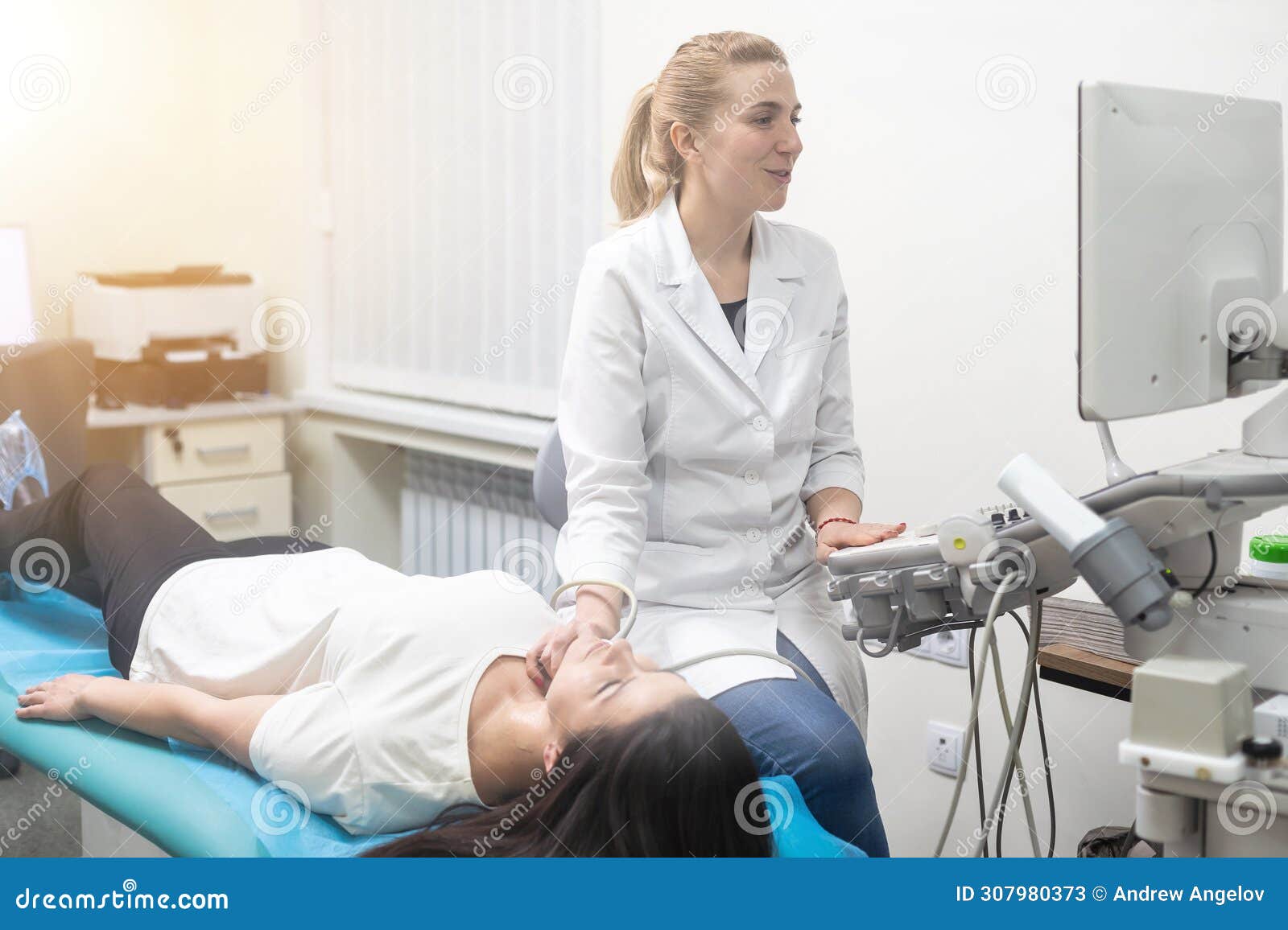 Woman Endocrinologist Making Ultrasonography To A Female Patient In An