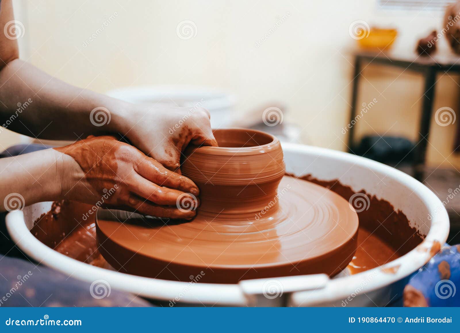 Woman is Engaged in Pottery. Potter in the Process of Creating a Clay ...