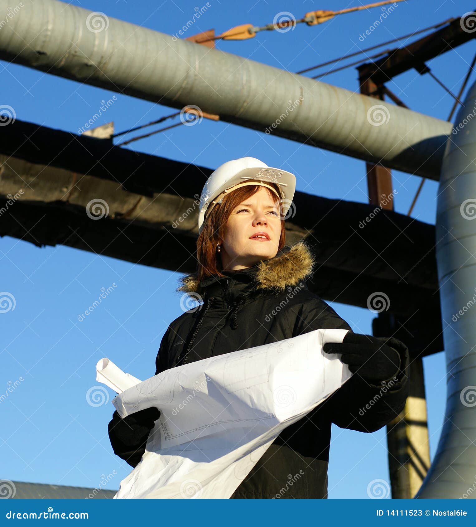 Woman Engineer Against Pipelines with Drawings Stock Image - Image of ...