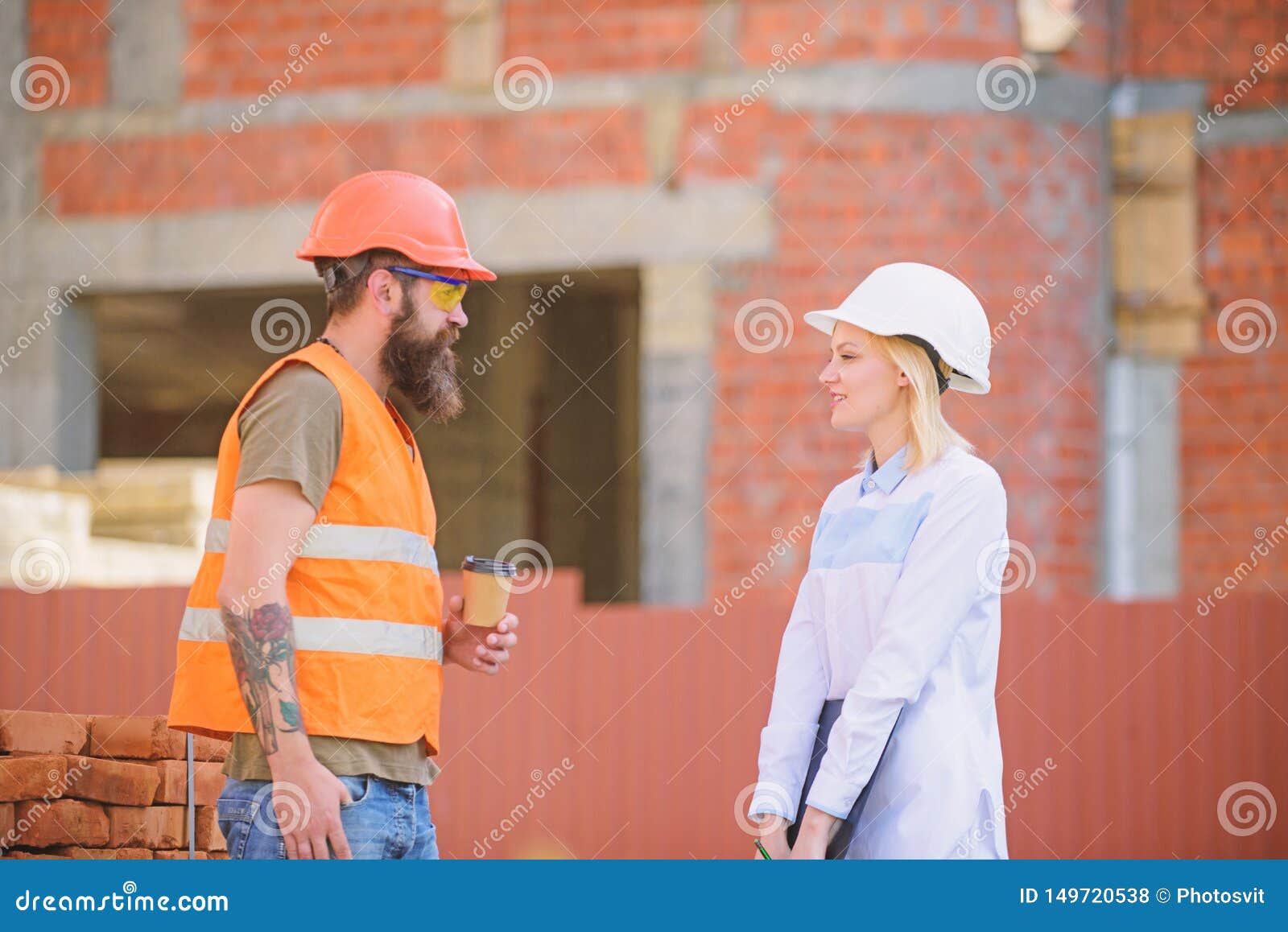 Woman Engineer and Brutal Builder Communicate Construction Site ...