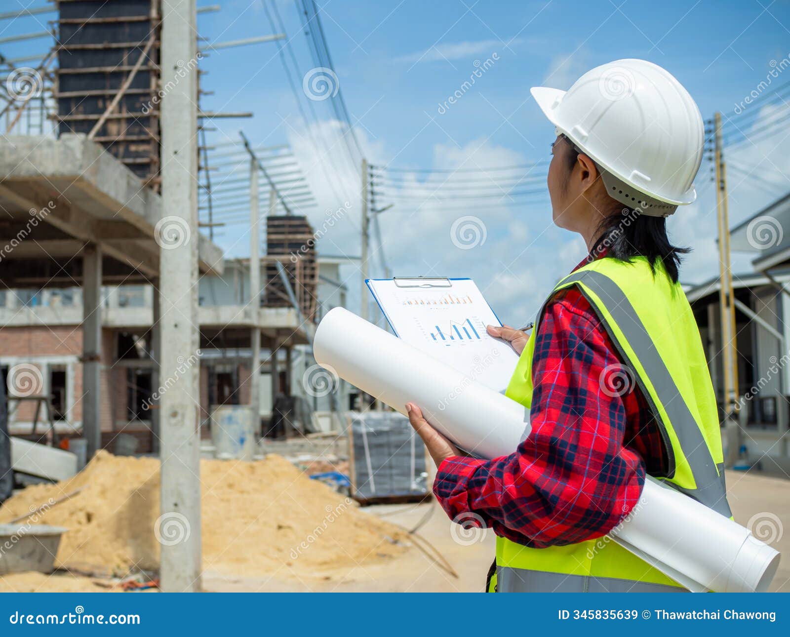 Woman Engineer Working at Site of a Large Building Project, Foreman ...