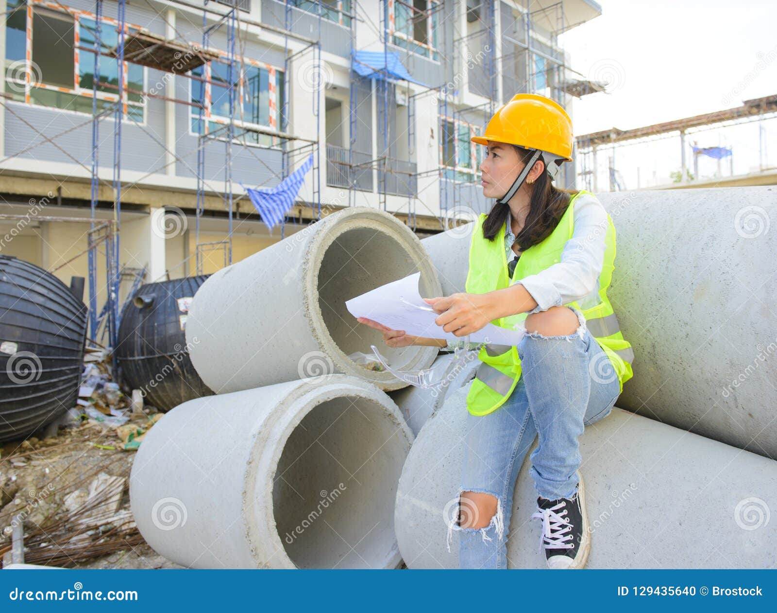 Engineers Holding Blueprint Project Working Outdoors Building Side With ...
