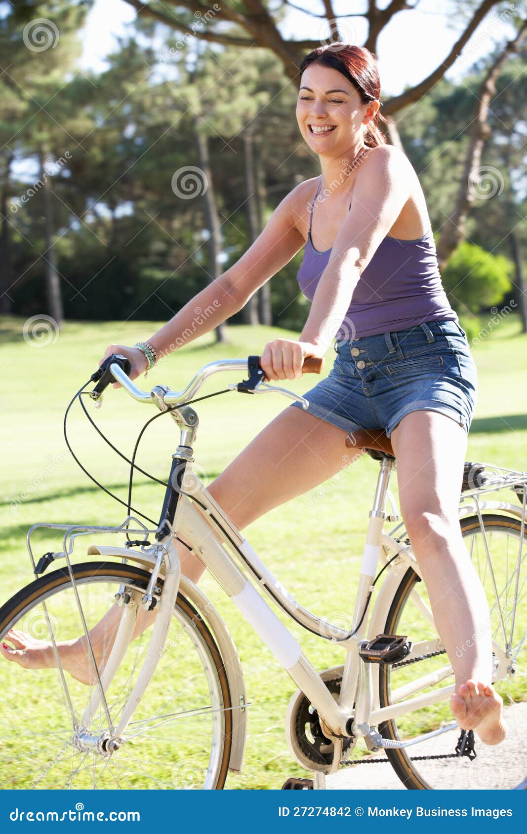 Woman Enjoying Cycle Ride stock photo. Image of sixties - 27274842