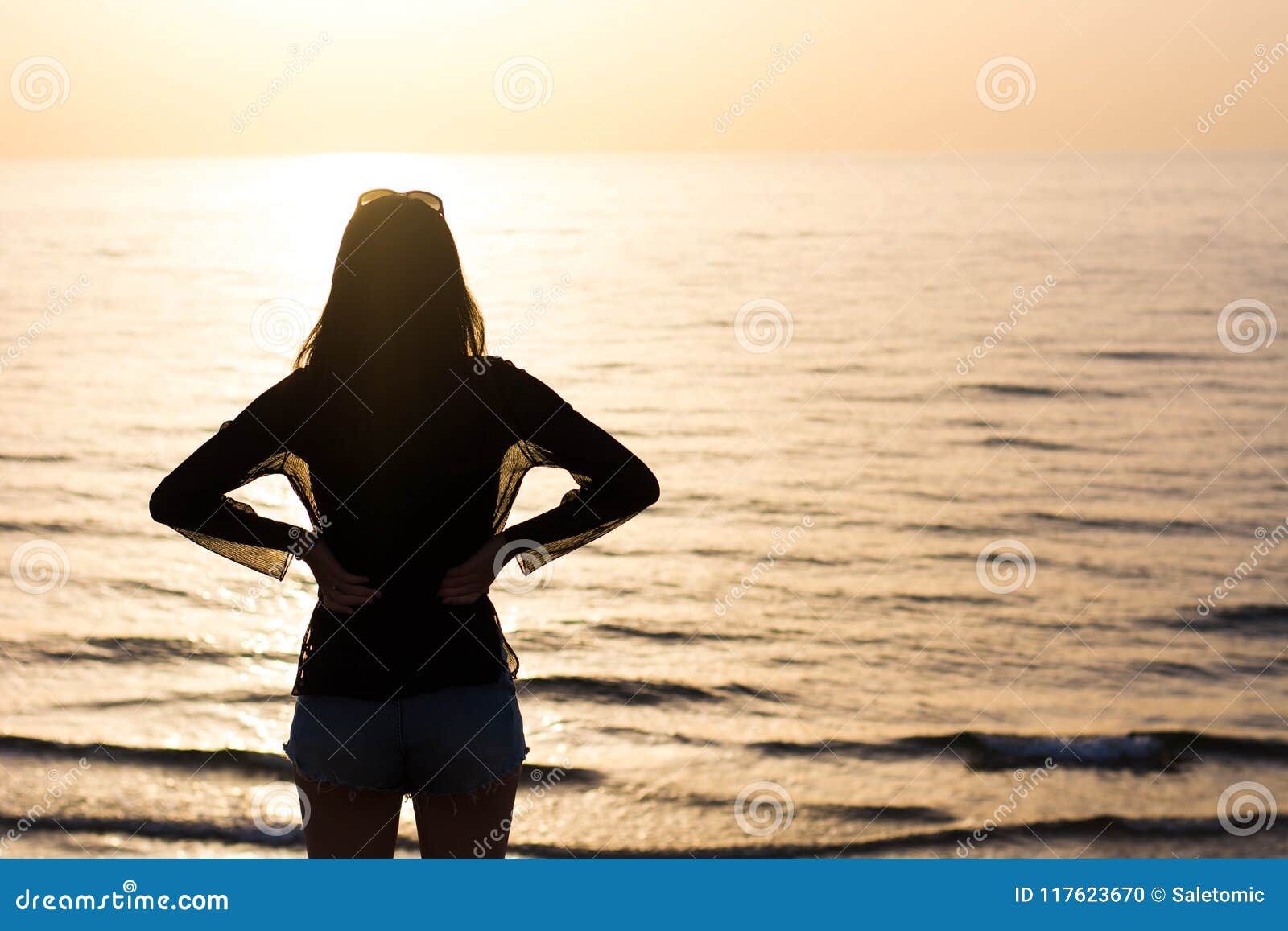 Woman Enjoying Sunset on the Beach Stock Photo - Image of rear, girl ...
