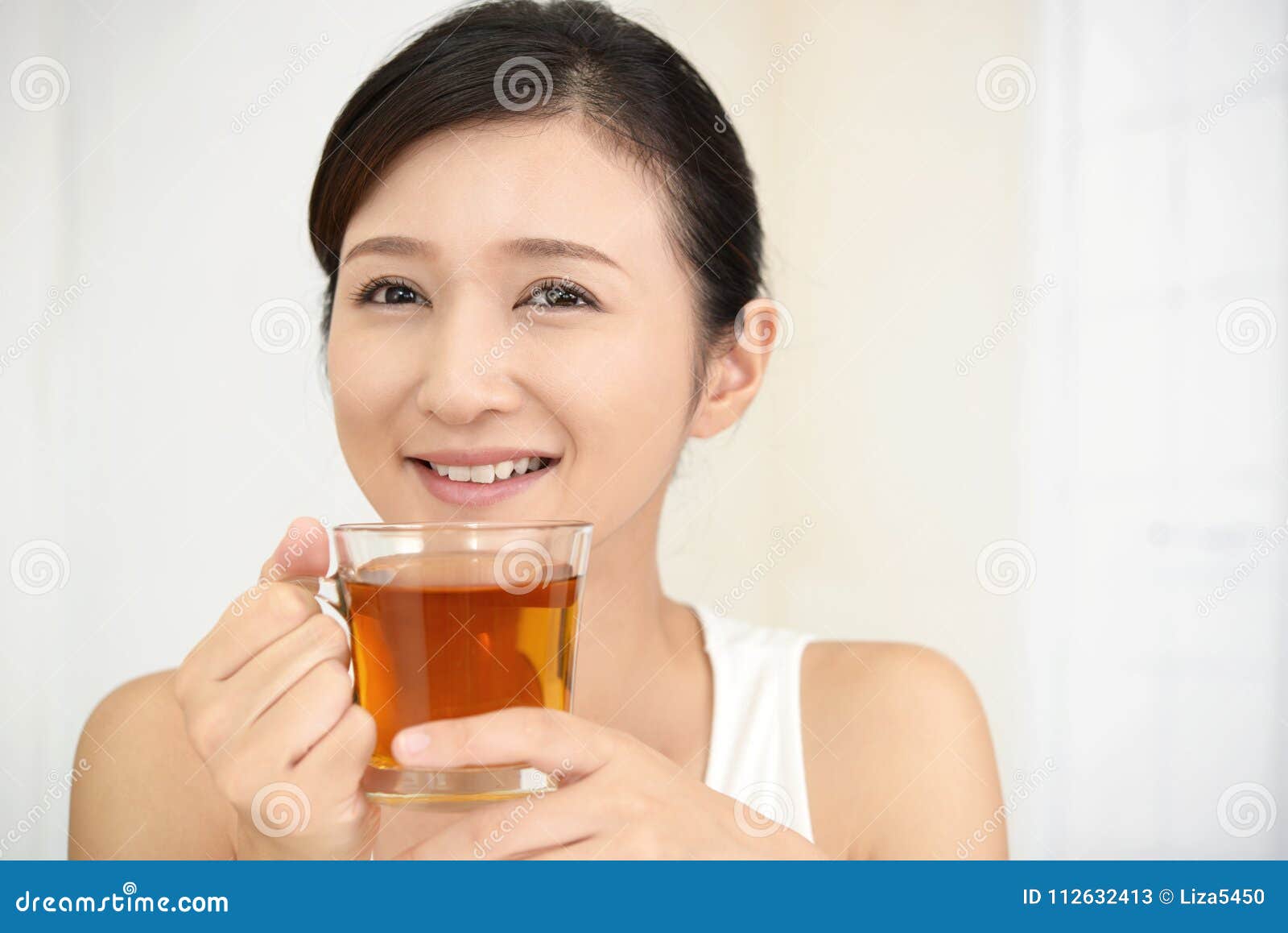 Woman enjoys having tea stock image. Image of happy - 112632413