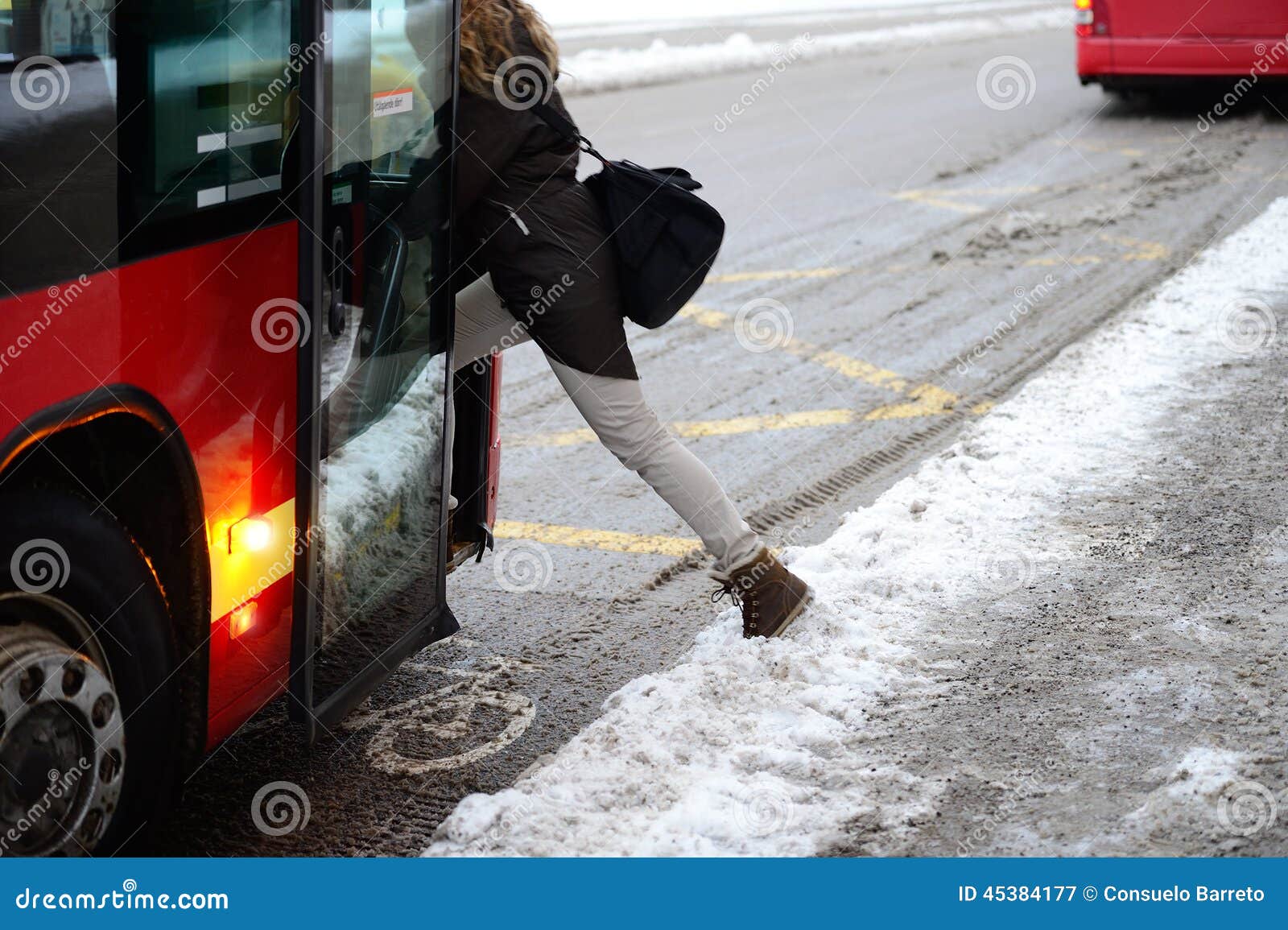 Woman Entering Bus in Winter Stock Image - Image of commute, light ...