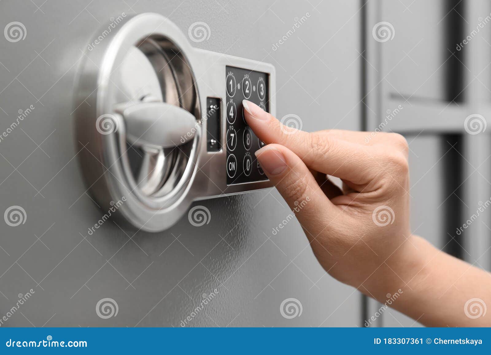 Woman Entering Code on Keypad of Safe, Closeup Stock Image - Image of ...