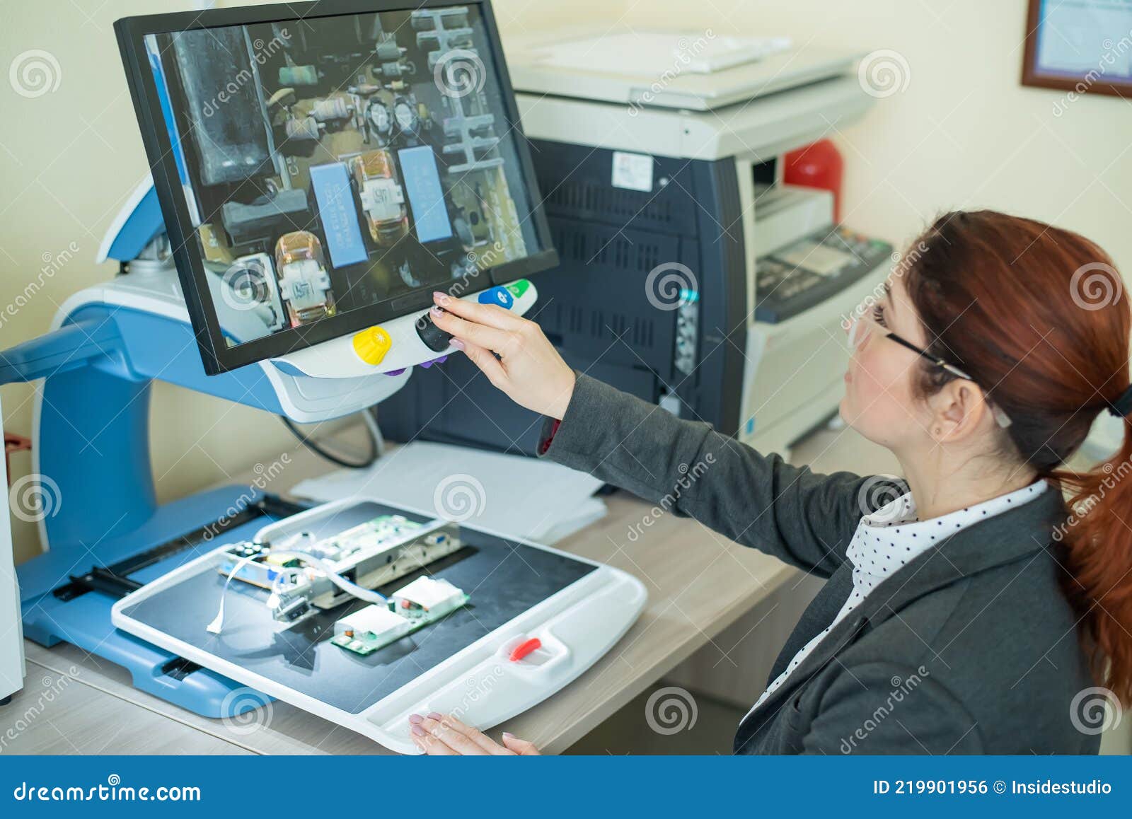 Woman Examines Microcircuits on a Special Apparatus for Reading the ...