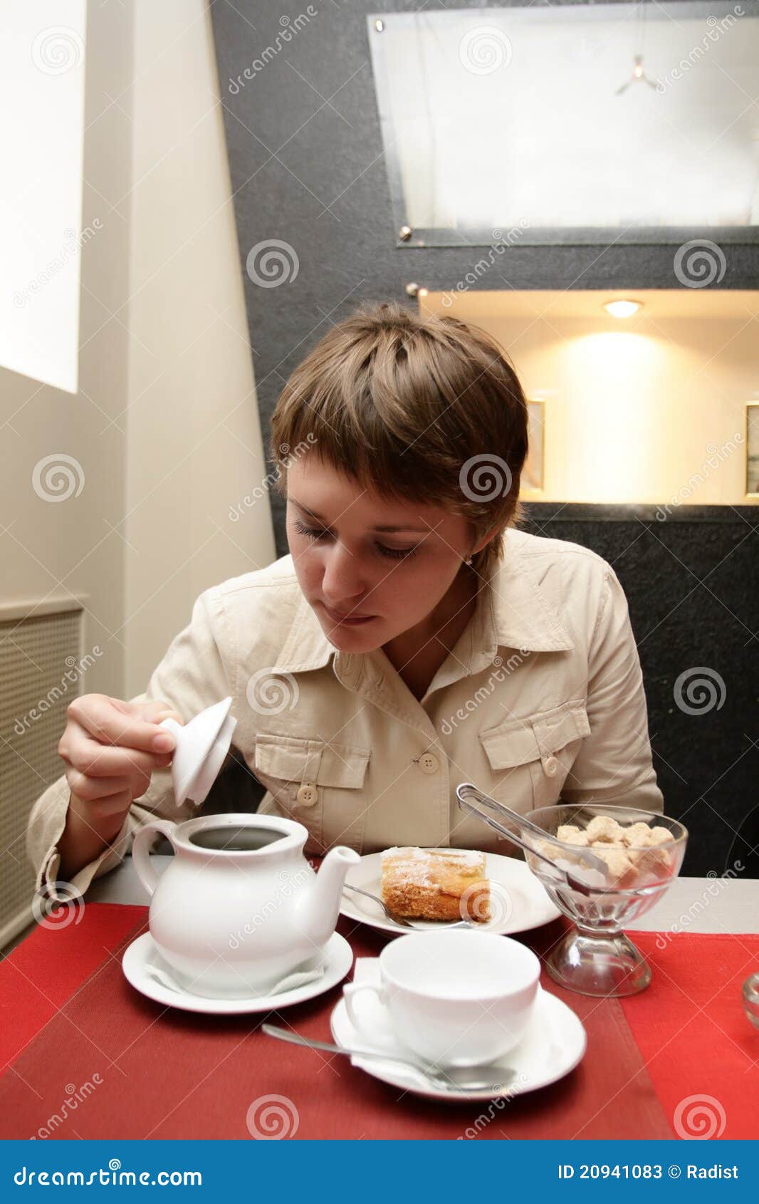Woman examines tea brewing stock image. Image of attractive - 20941083