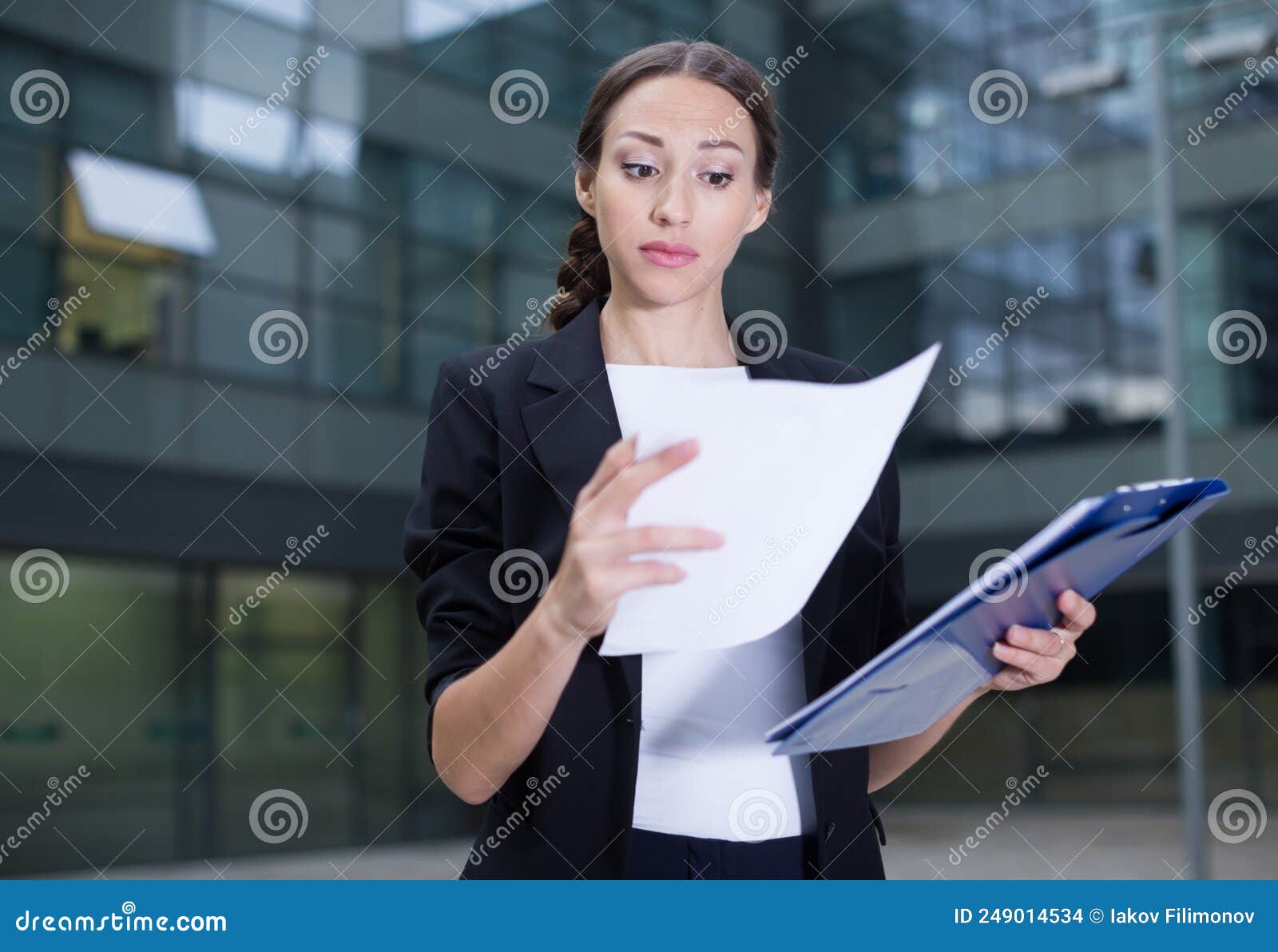 Woman is Examining Documents Stock Photo - Image of caucasian, outdoor ...
