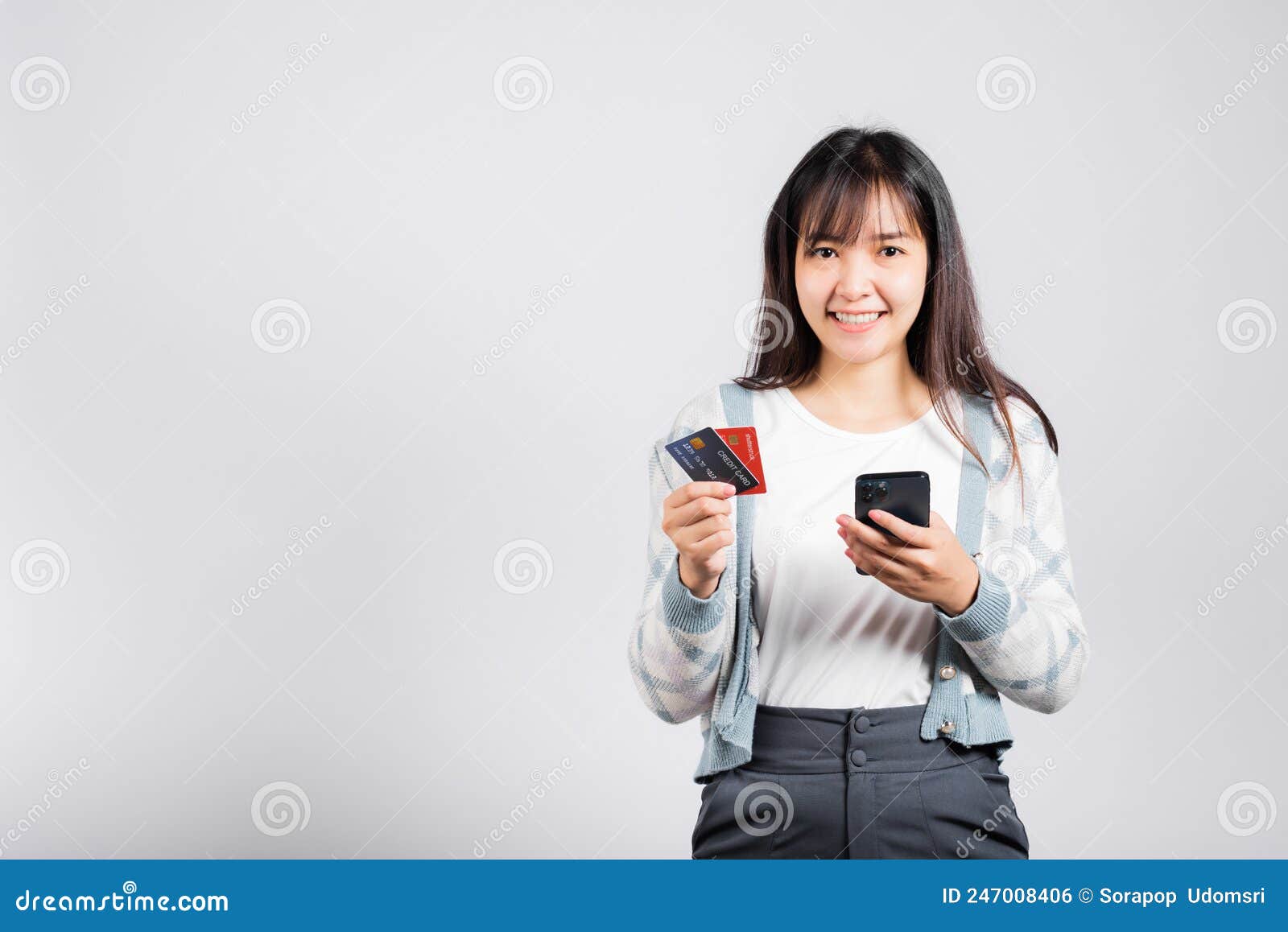Woman Excited Smiling Hold Mobile Phone And Plastic Debit Credit Bank