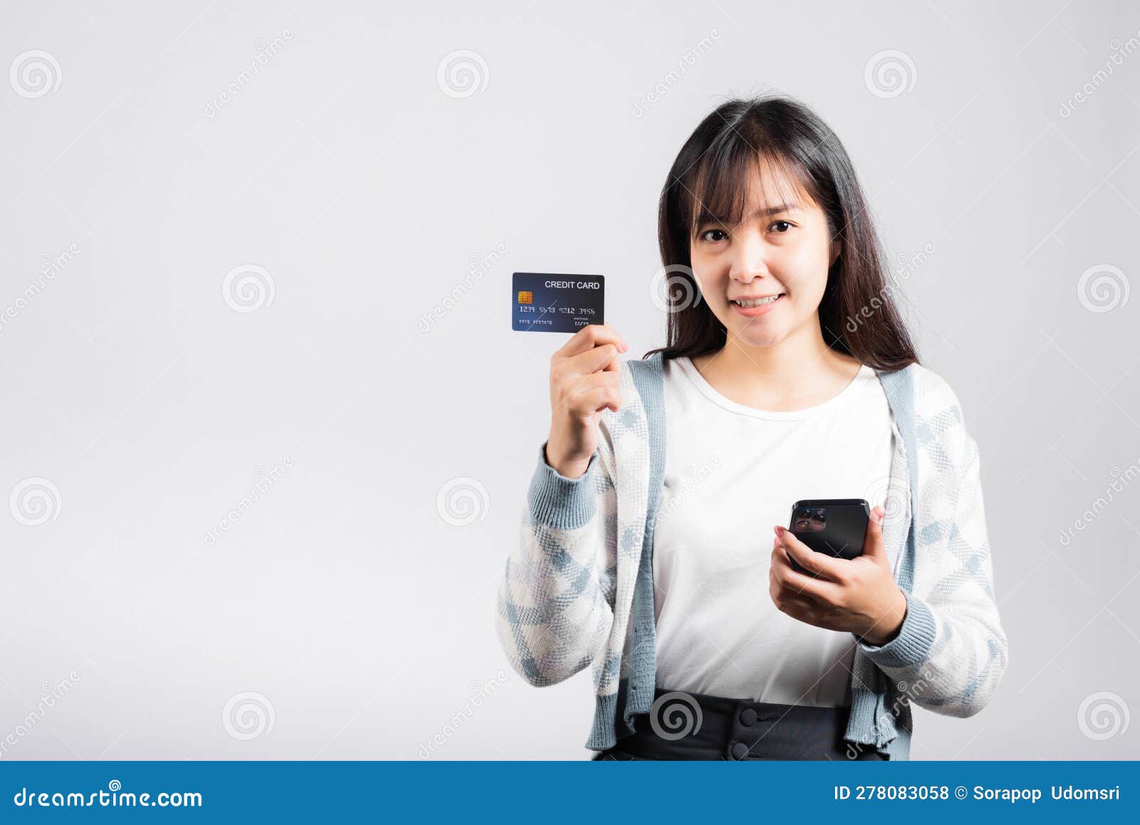 Woman Excited Smiling Hold Mobile Phone And Plastic Debit Credit Bank
