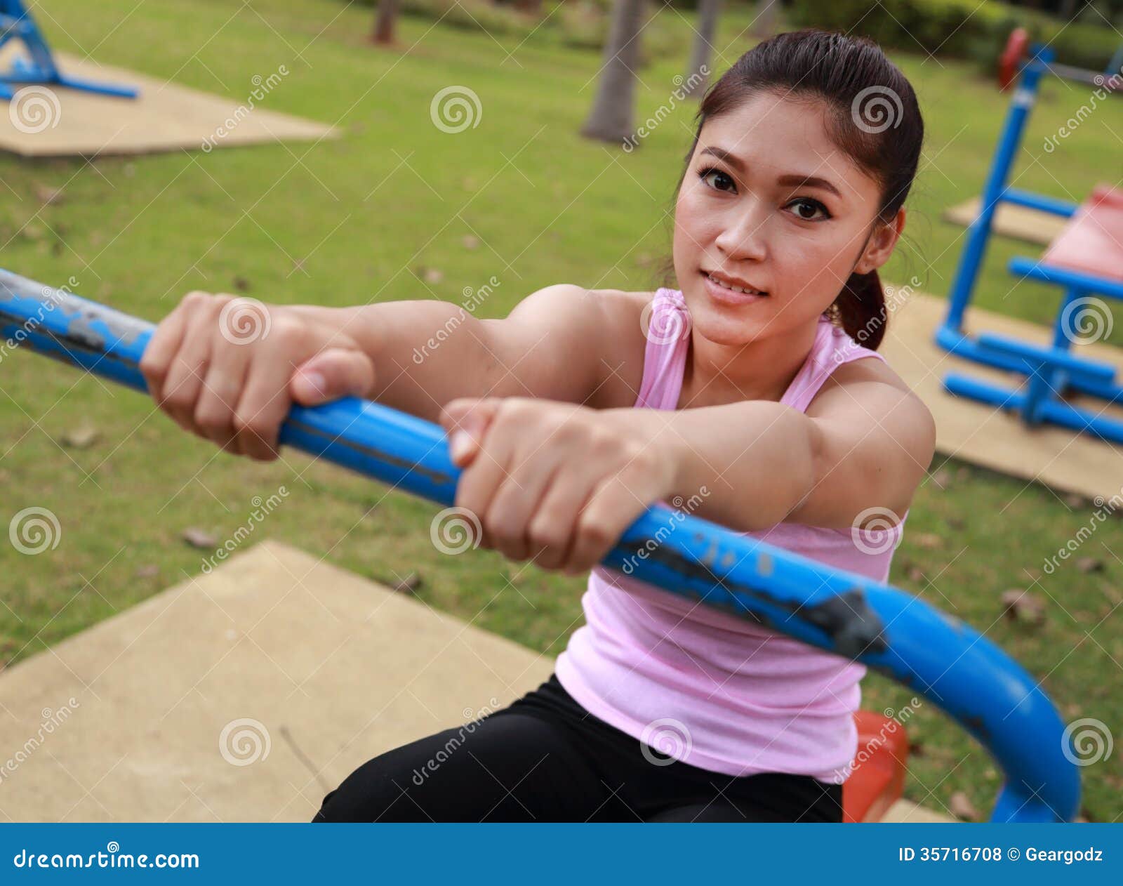 Woman Exercising with Exercise Equipment in the Park Stock Photo ...