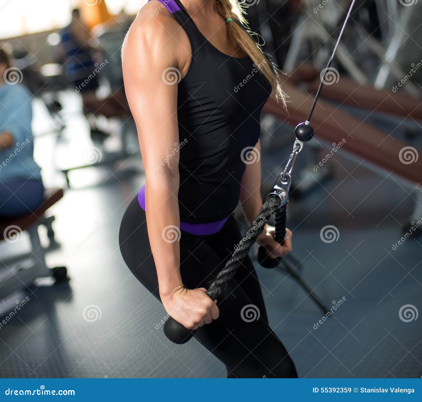 Woman Exercising Her Arms and Back at the Gym on a Stock Image - Image ...