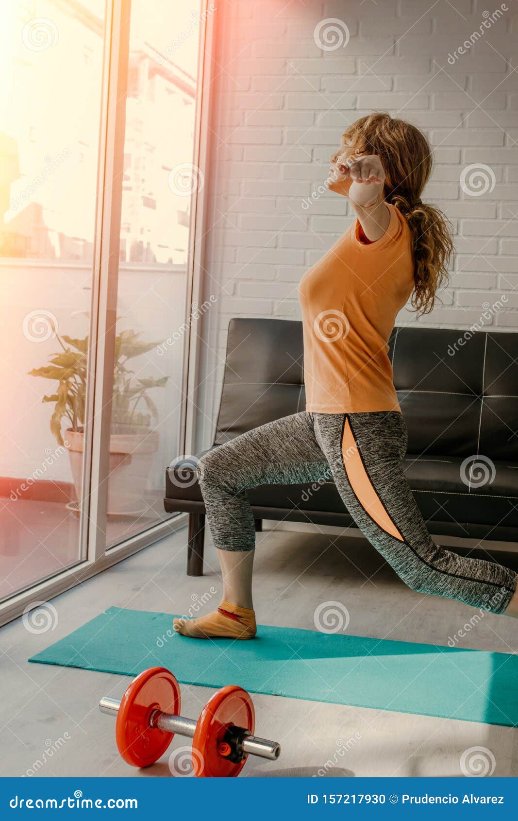 Woman exercising at home stock photo. Image of exercise - 157217930
