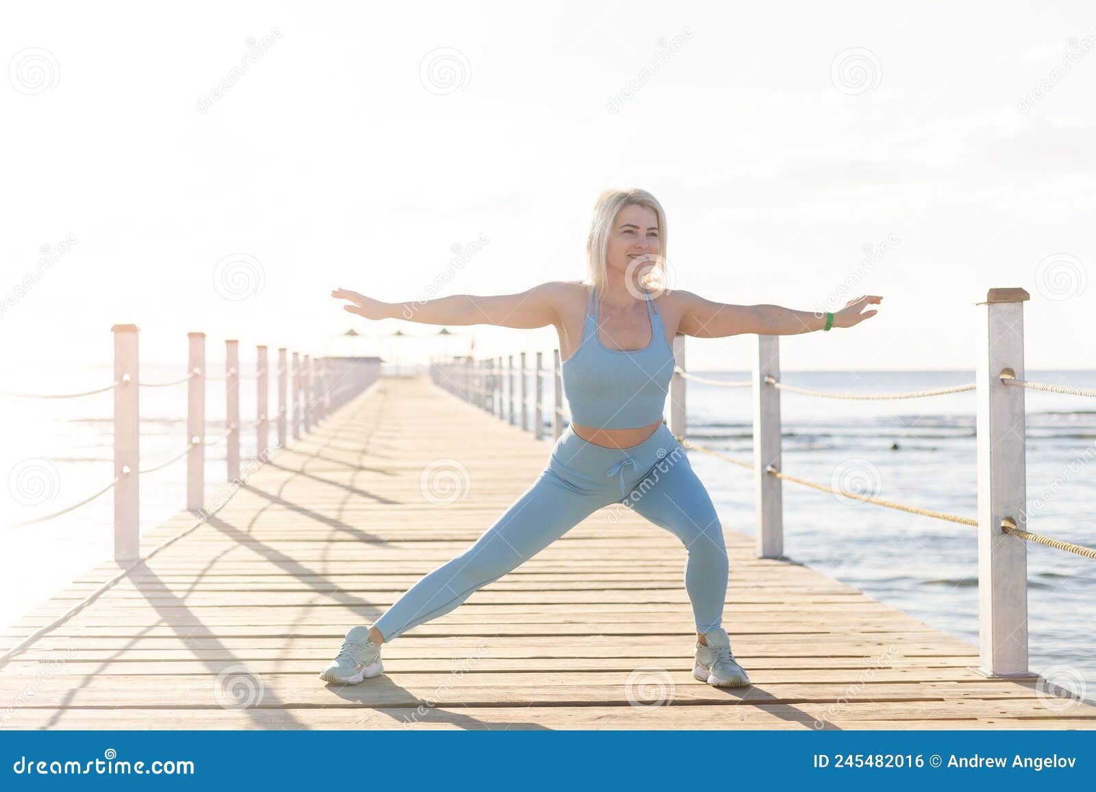 Woman Exercising on Pontoon by the Sea Stock Photo - Image of people ...