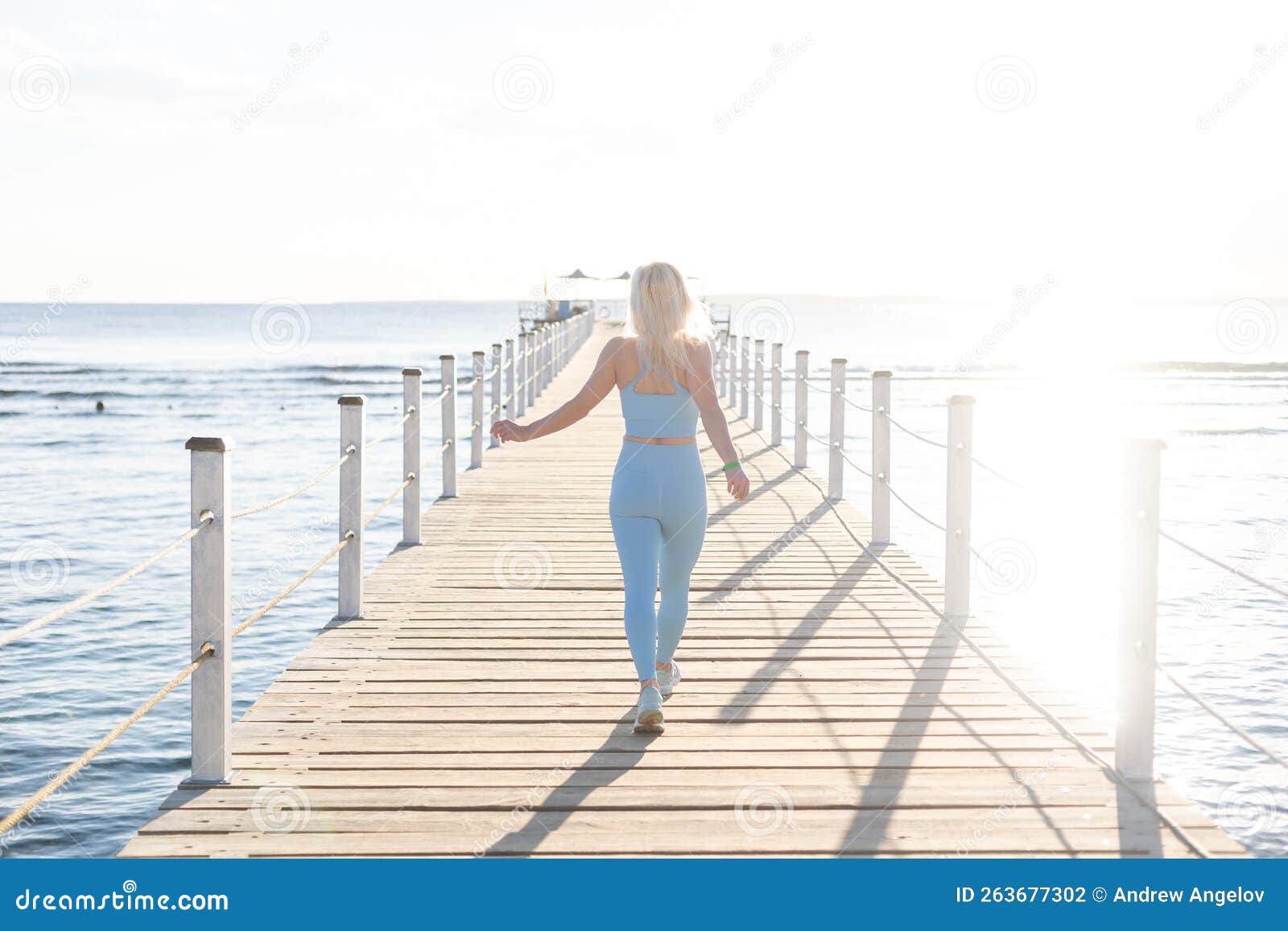 Woman Exercising on Pontoon by the Sea Stock Photo - Image of woman ...