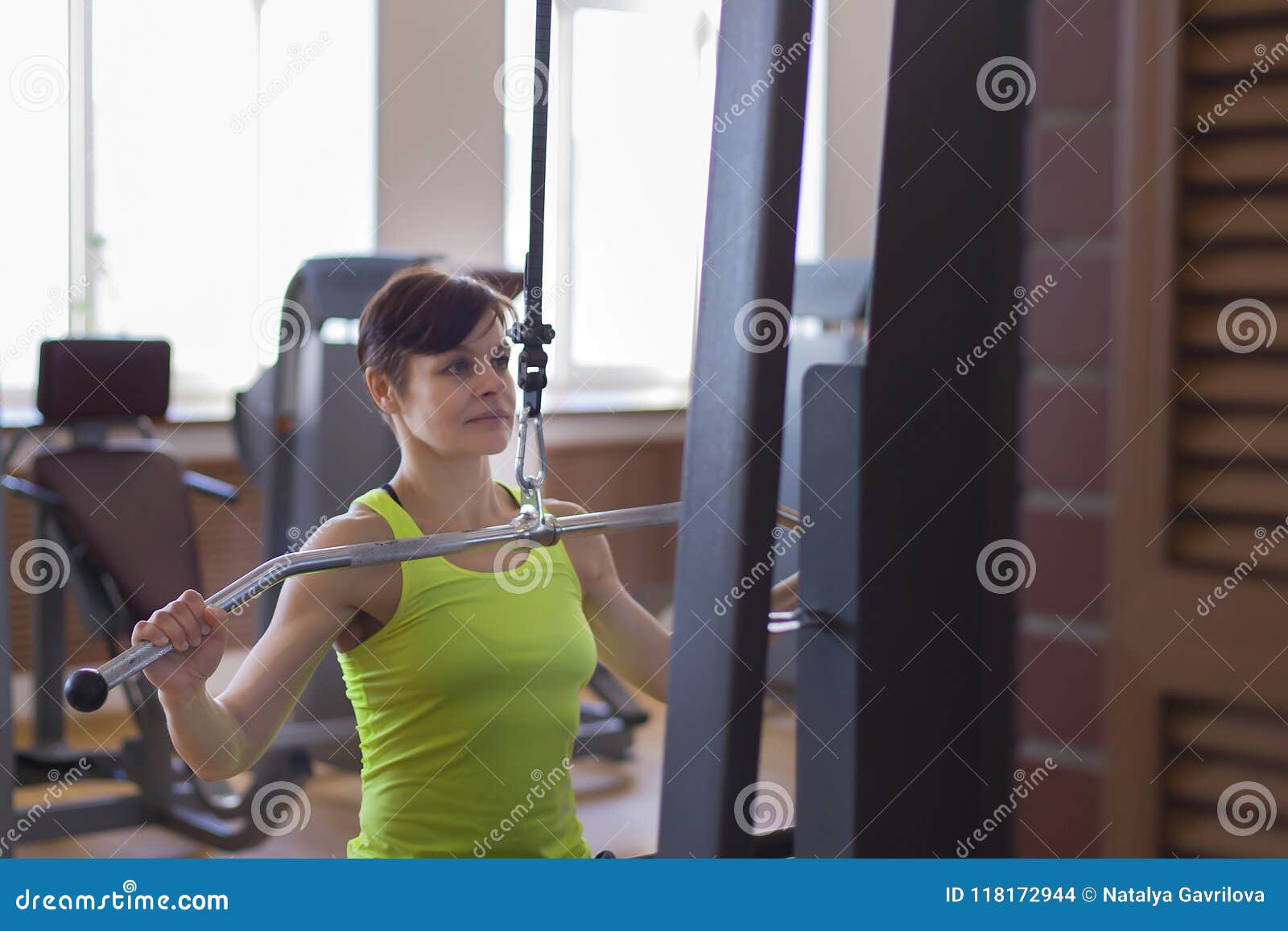 Woman Exercising on the Simulator Doing Strength Exercises Stock Photo ...