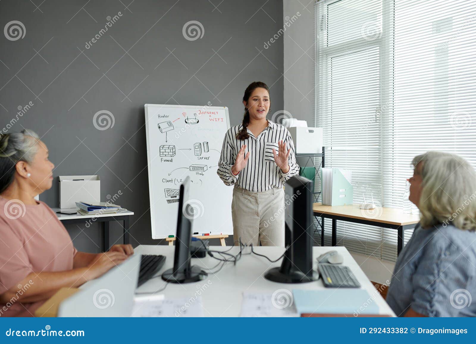 Woman Explaining How Computers Work Stock Photo - Image of attending ...
