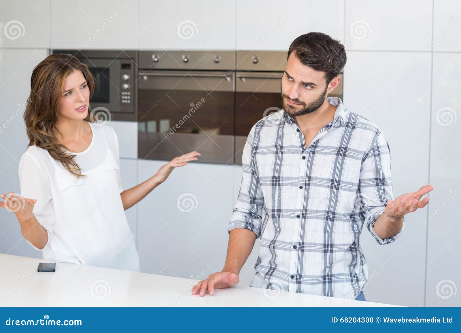 Woman Explaining Man by Table Stock Photo - Image of caucasian, homey ... Woman Explaining Man by Table Stock Photo - Image of caucasian, homey ...