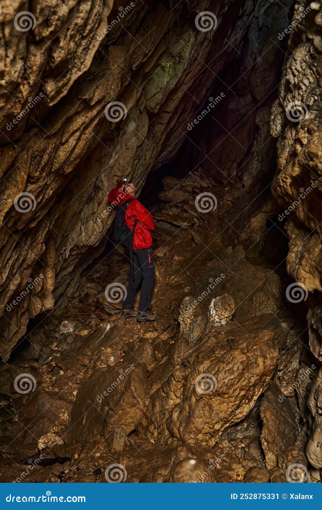 Woman explorer in a cave stock image. Image of inside - 252875331