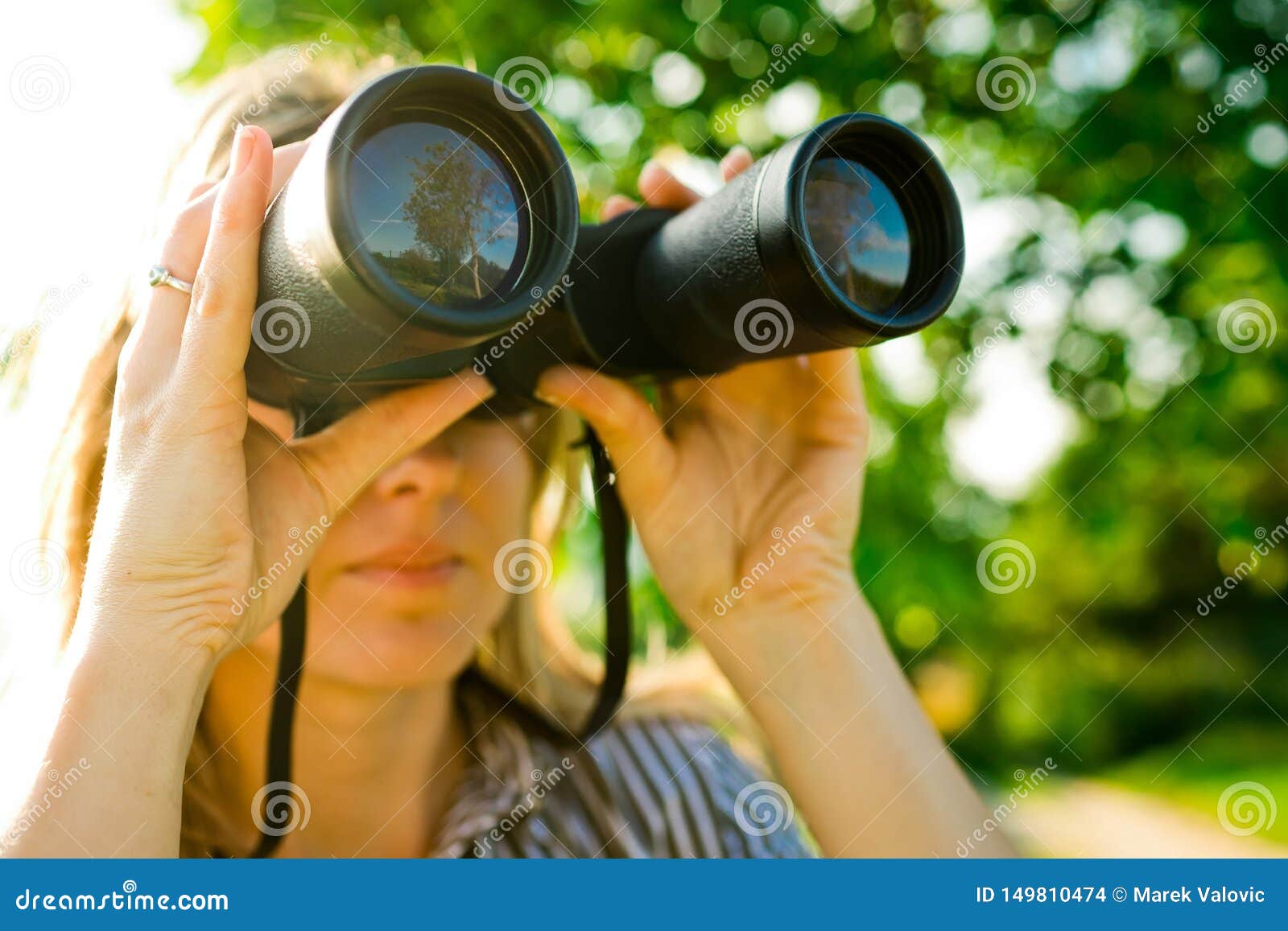 A Woman Explorer is Using Black Binoculars - Outdoor Stock Photo ...