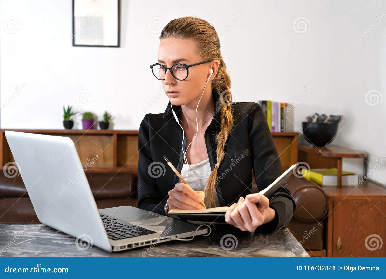 Young Woman with Eyeglasses, Headphones, Laptop Studying Working Online ... Young Woman with Eyeglasses, Headphones, Laptop Studying Working Online ...
