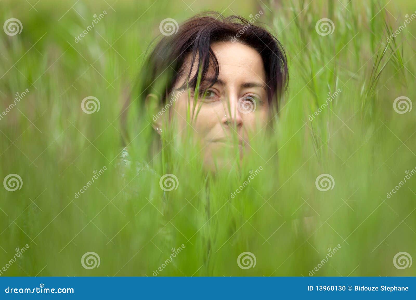 Woman face in grass stock photo. Image of looking, pensive - 13960130