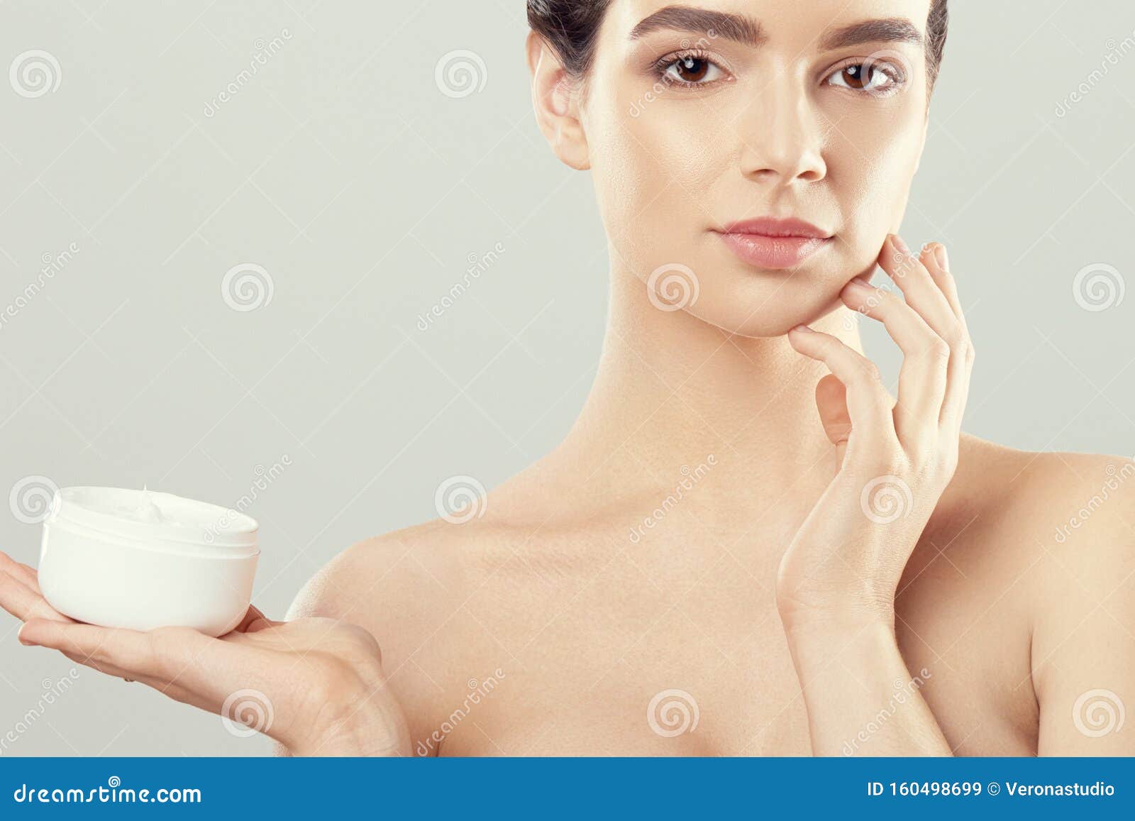 Woman Face Skin Care Portrait Of Attractive Young Female Applying