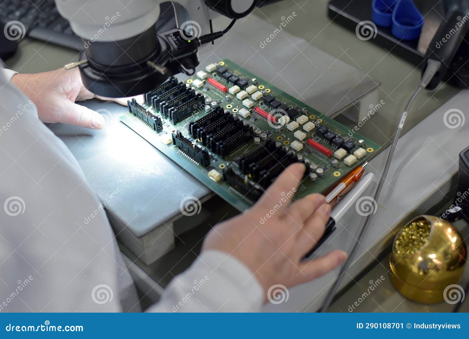 Woman in a Factory for the Production of Electronic Components Checks ...