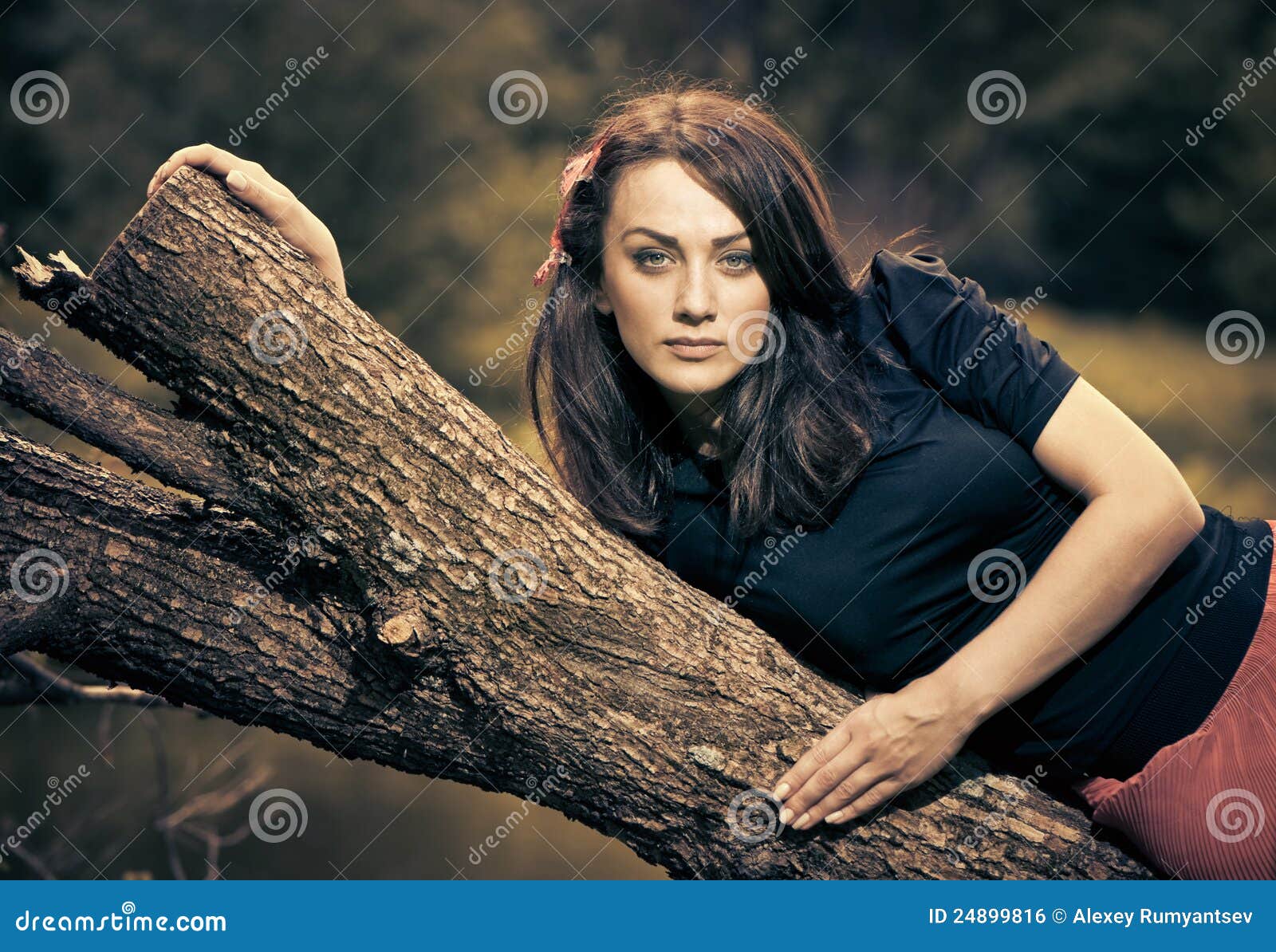 Woman on a fallen tree stock photo. Image of positive - 24899816