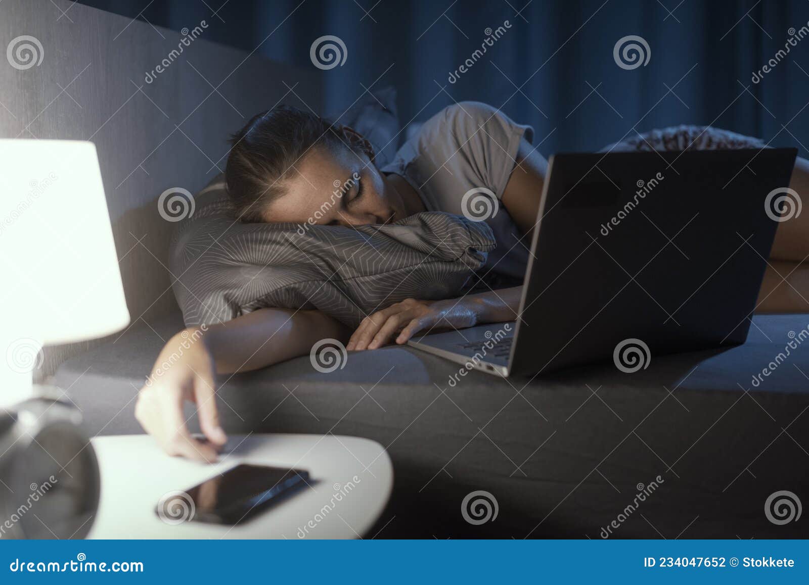 Woman Falling Asleep in Front of Her Laptop in Bed Stock Photo - Image ...
