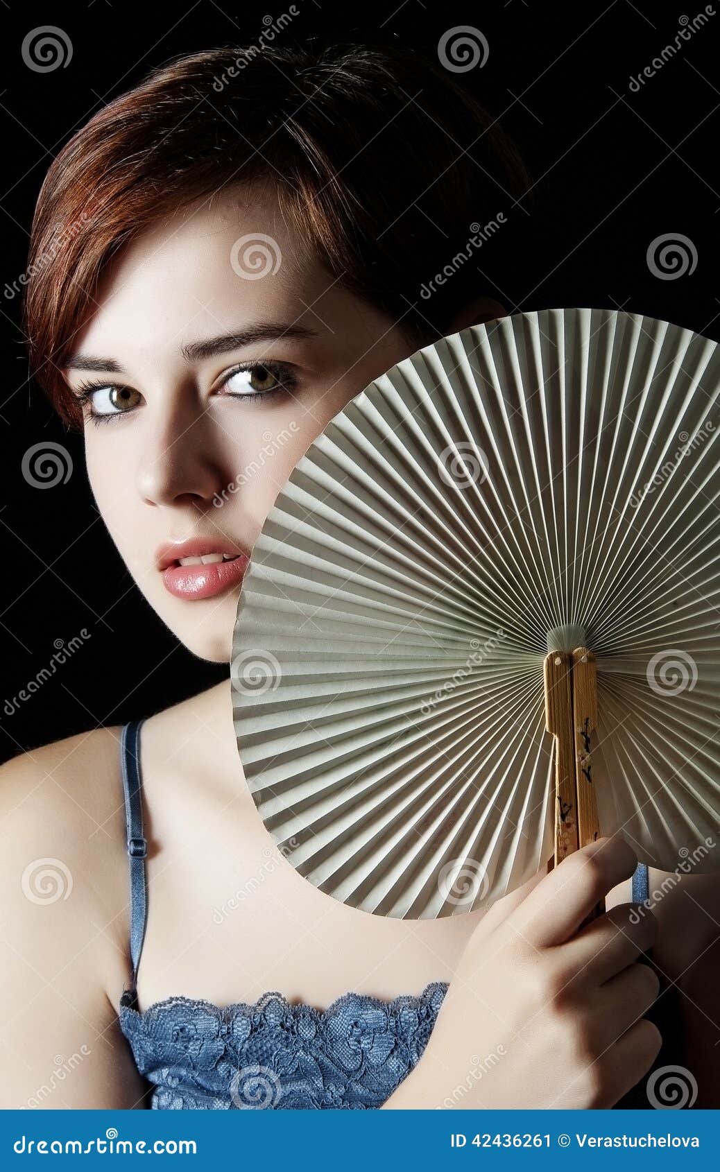 Woman with a fan stock image. Image of darkness, girl - 42436261