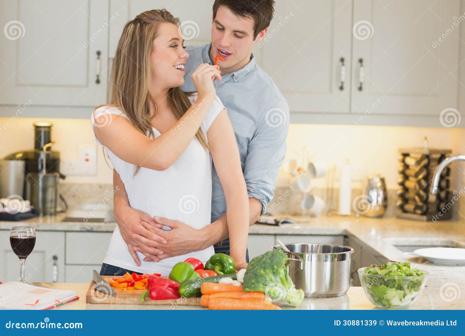 Woman feeding man jokingly stock image. Image of embracing - 30881339