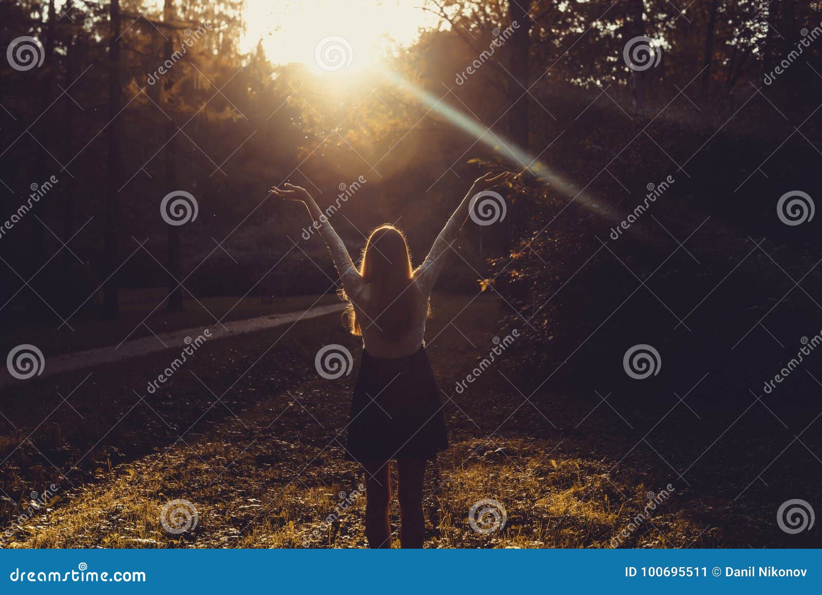 Woman Feeling Free On Sunset Silhouette Of The Woman Spreading Arms