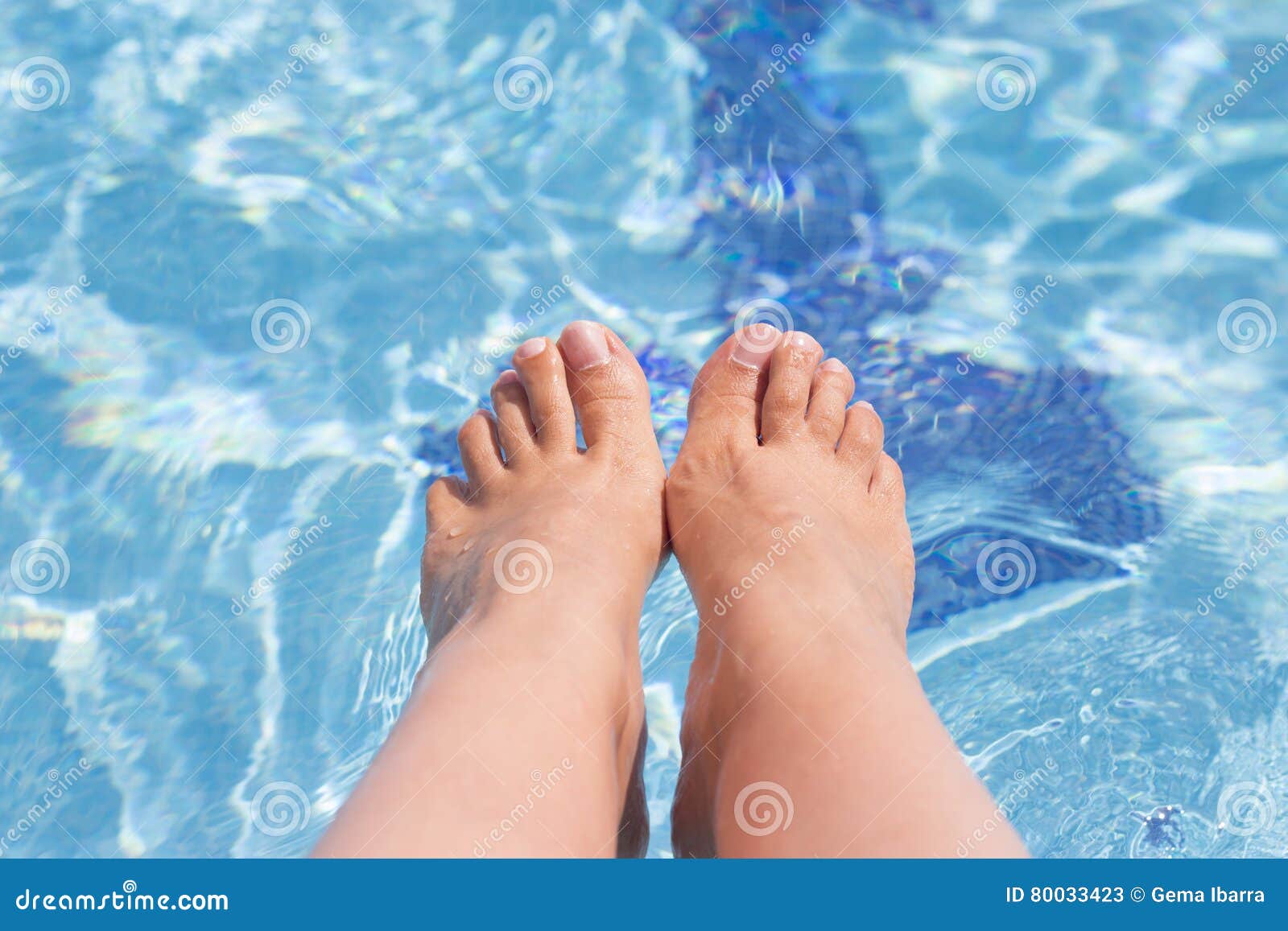Woman feet on pool water stock image. Image of female - 80033423