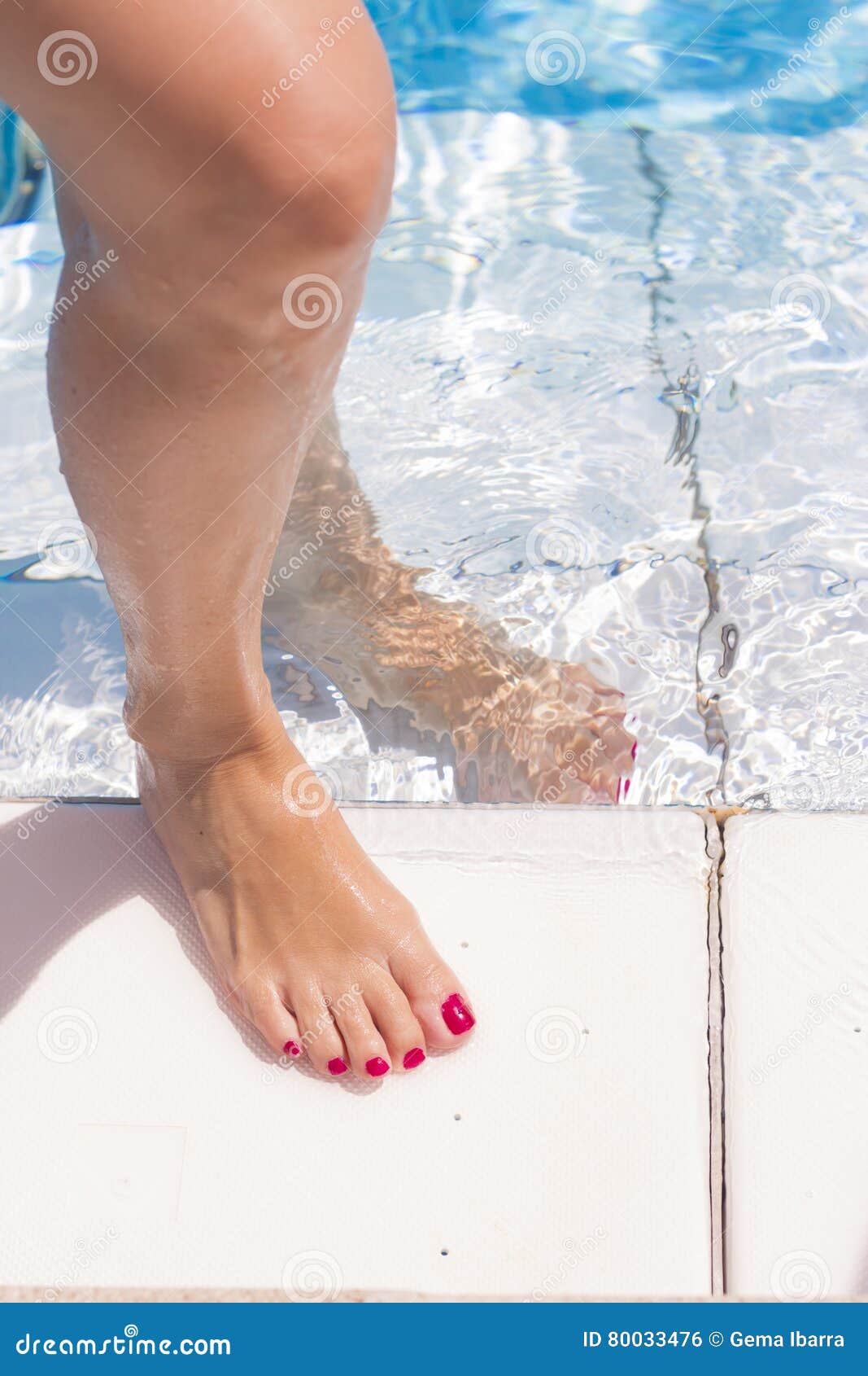 Woman feet on pool water stock photo. Image of vacation - 80033476