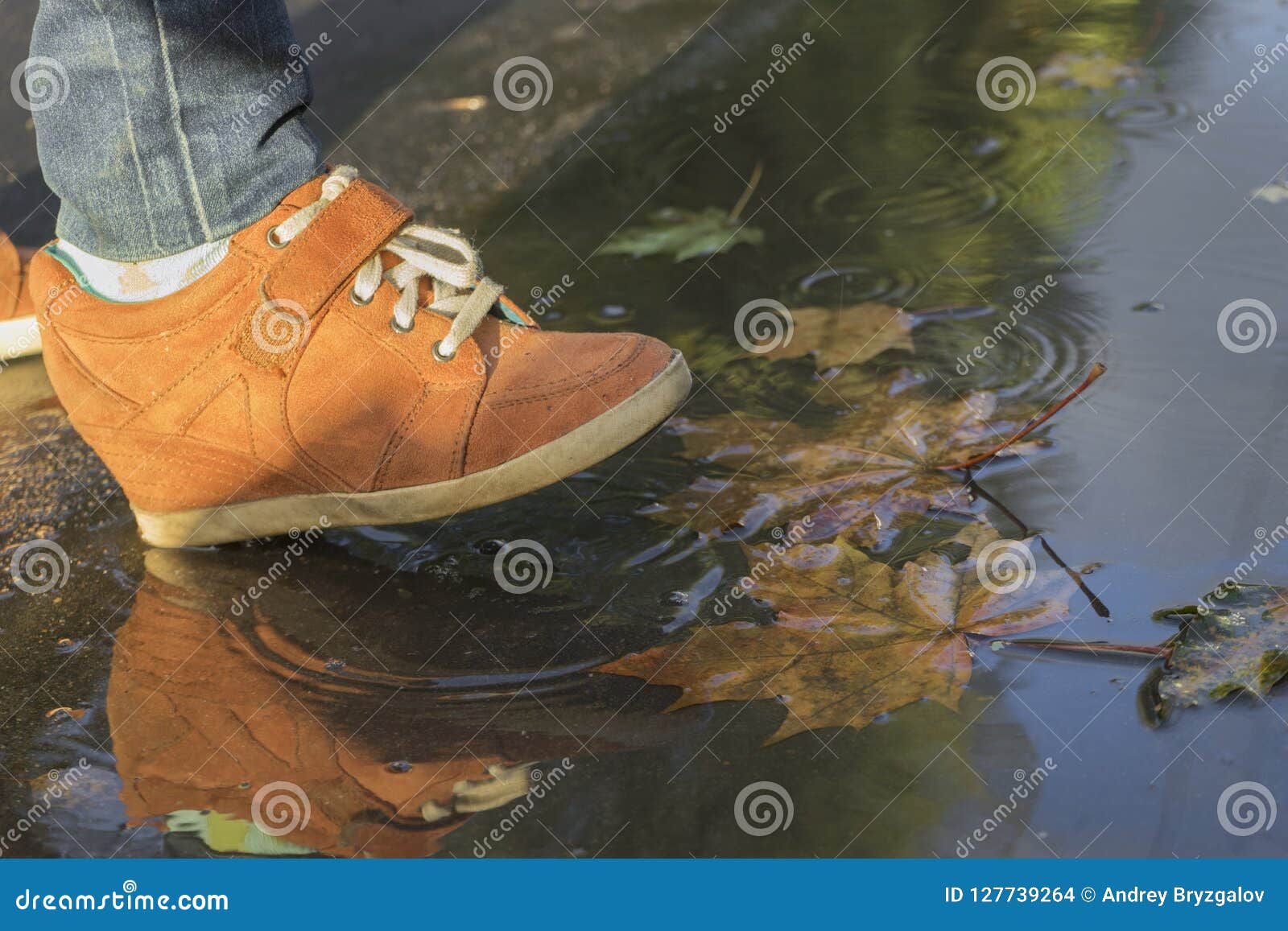 Woman Feet Walking in a Puddle in Orange Boots Stock Photo - Image of ...