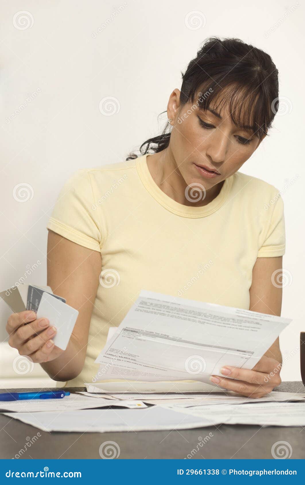 Woman Figuring Out Bills stock photo. Image of hispanic - 29661338