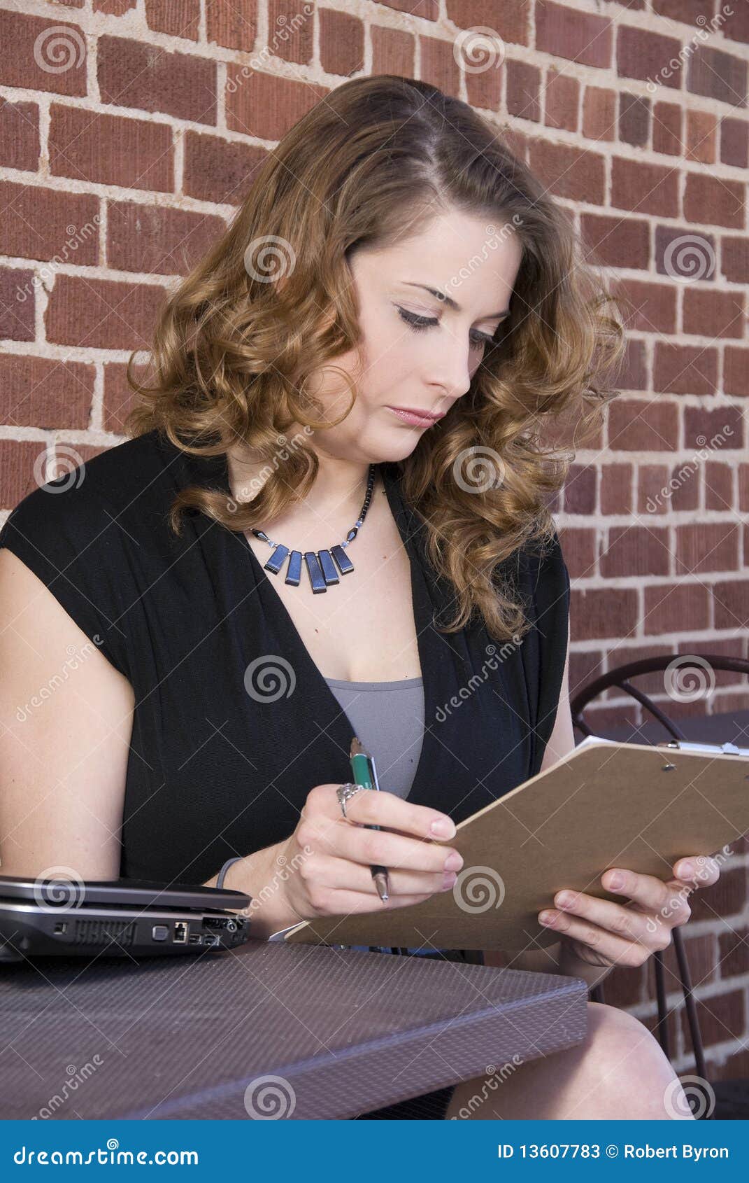 Woman Filing Out a Form stock image. Image of girl, beautiful - 13607783